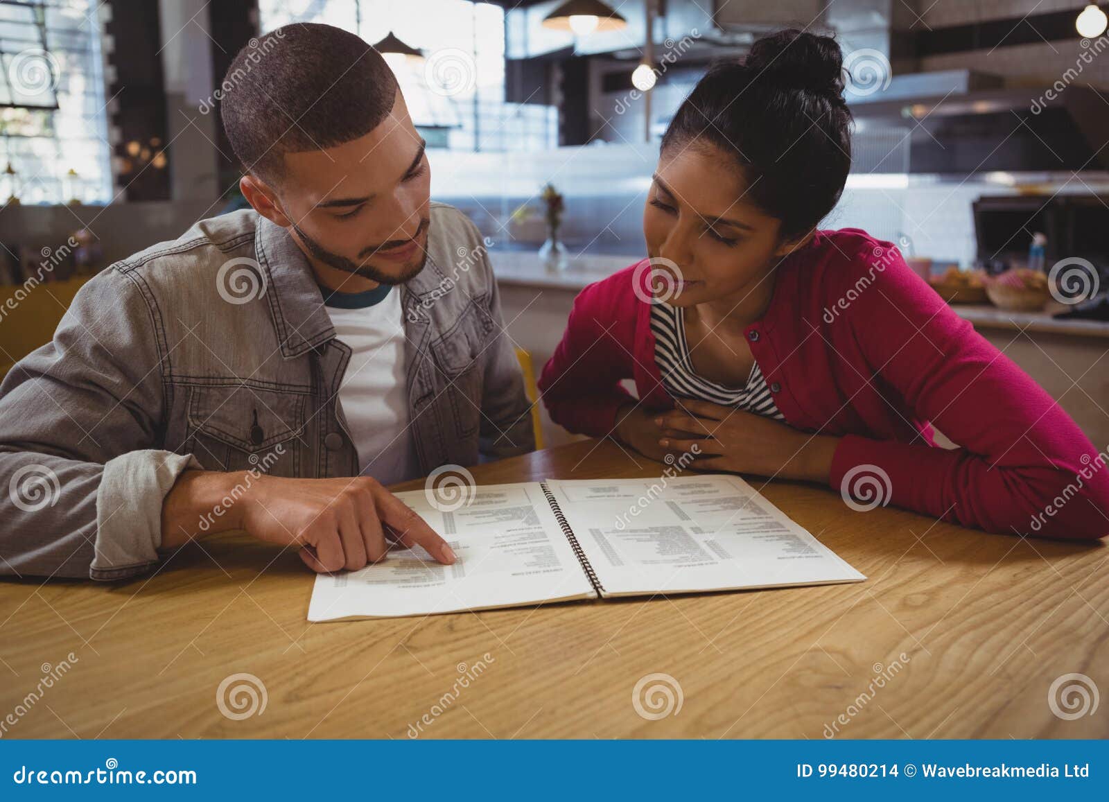 Young Friends Reading Menu in Cafe Stock Photo - Image of friendly ...