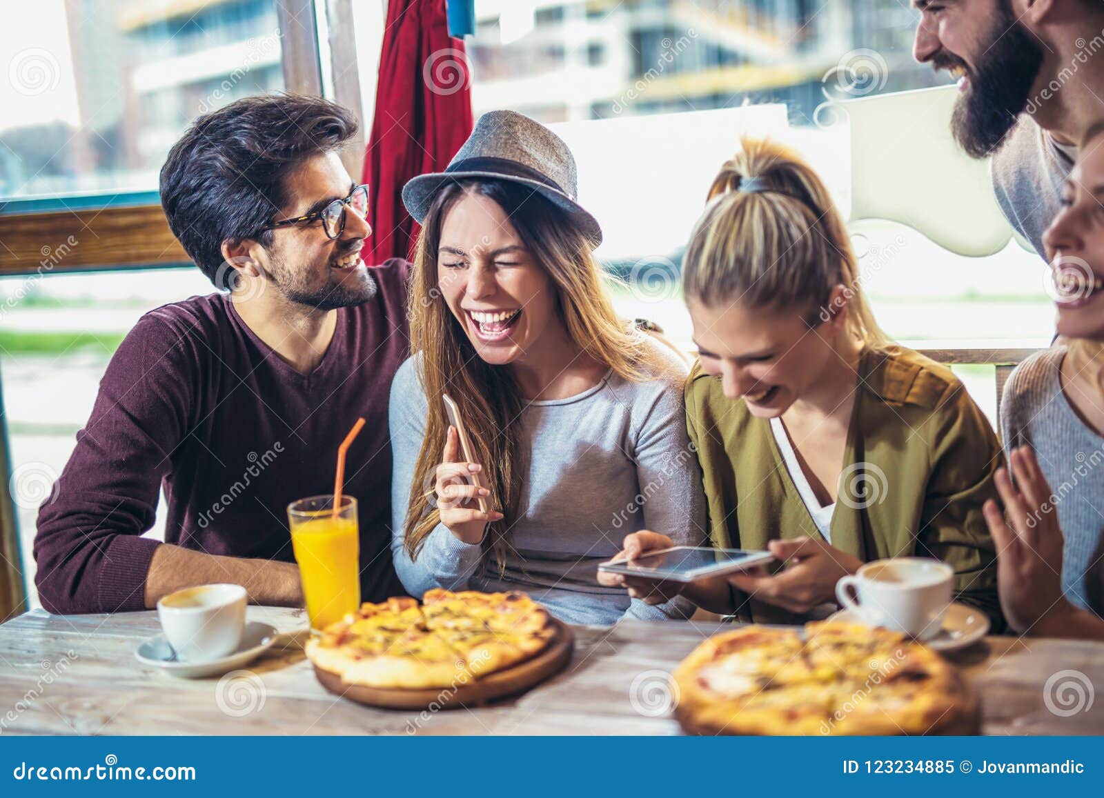 Young Friends Sharing Pizza in a Cafe Stock Image - Image of happiness ...