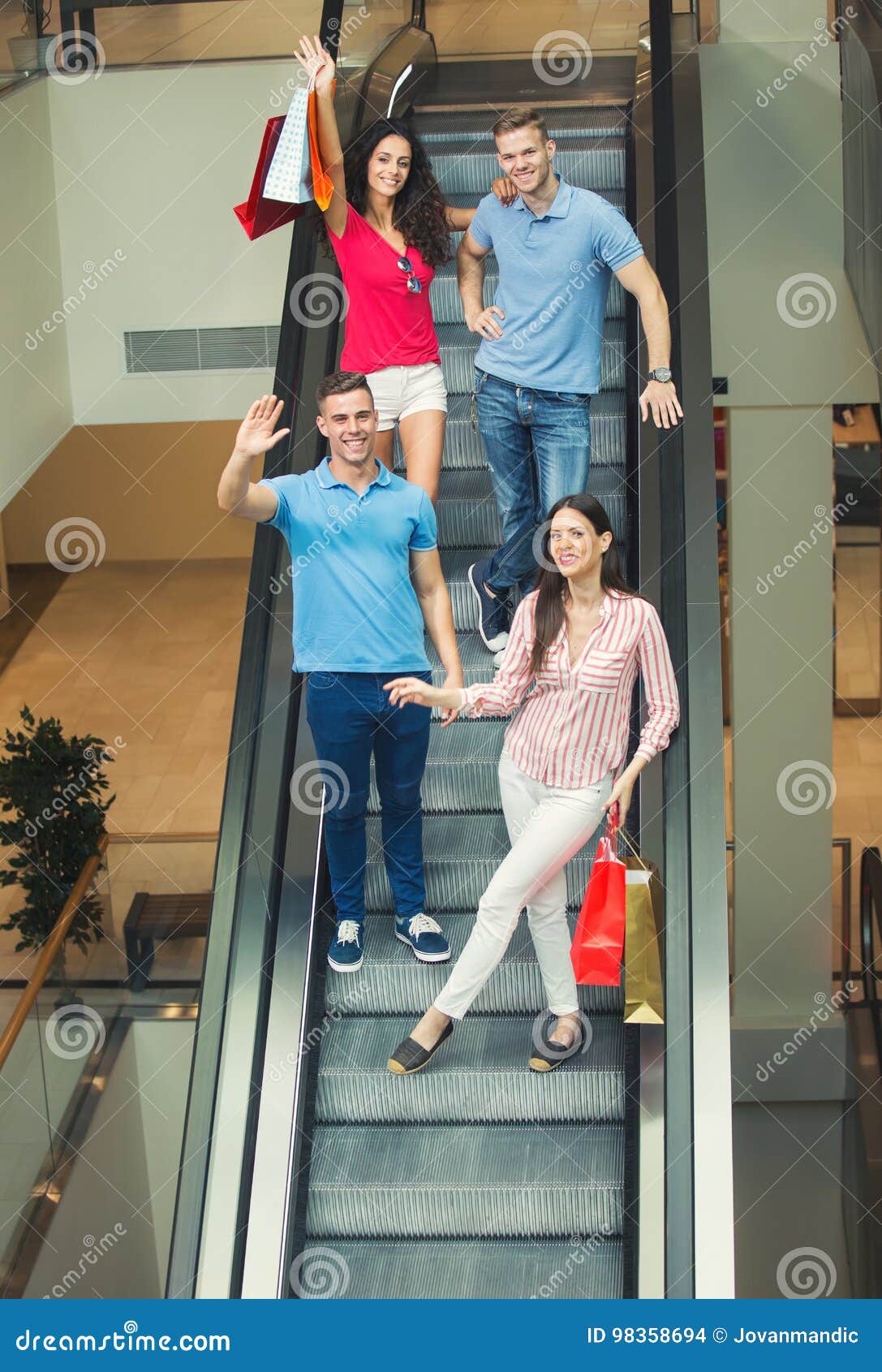 Young Friends Shopping in Mall Together Stock Photo - Image of black ...
