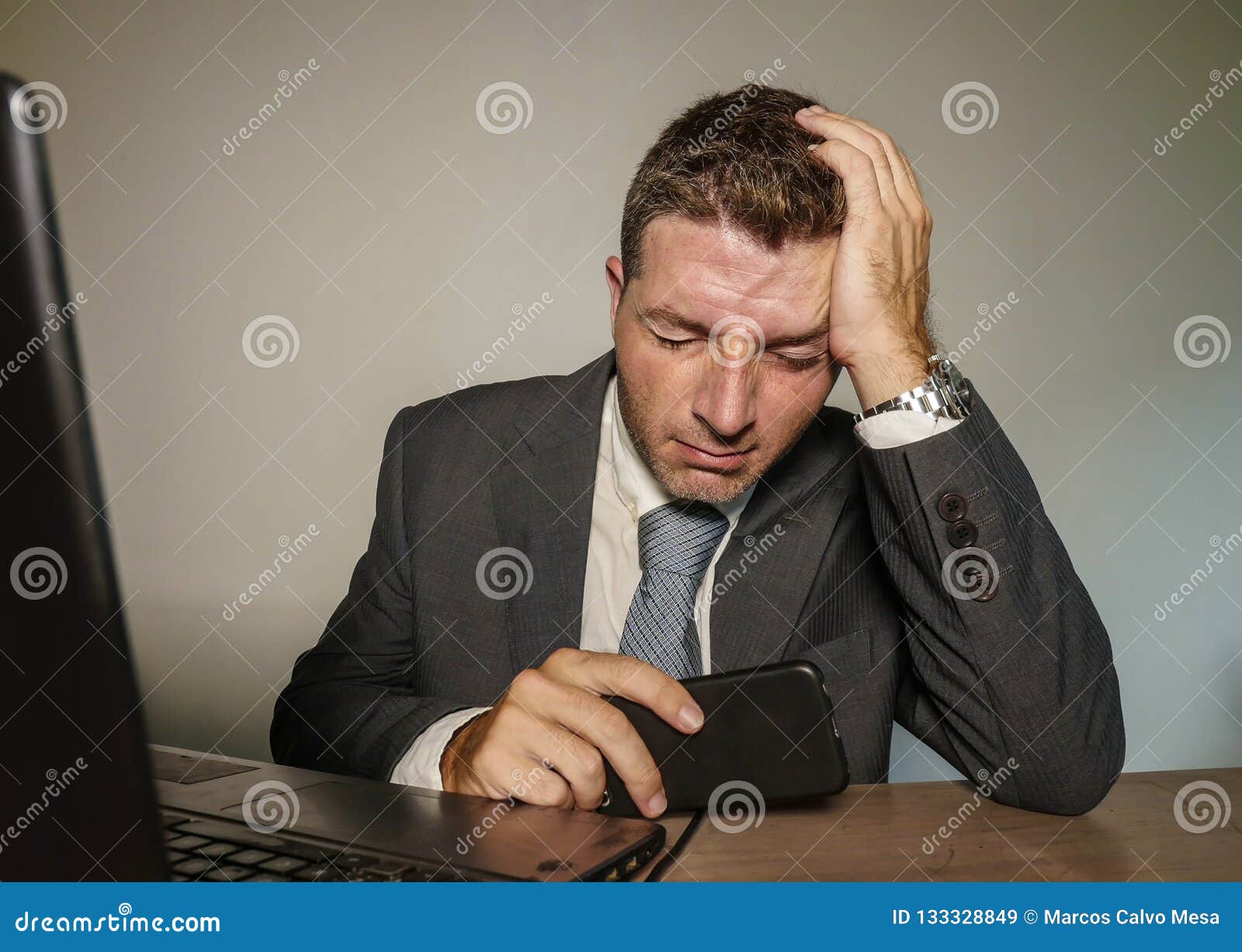 Young Frustrated And Stressed Businessman In Suit And Tie Working