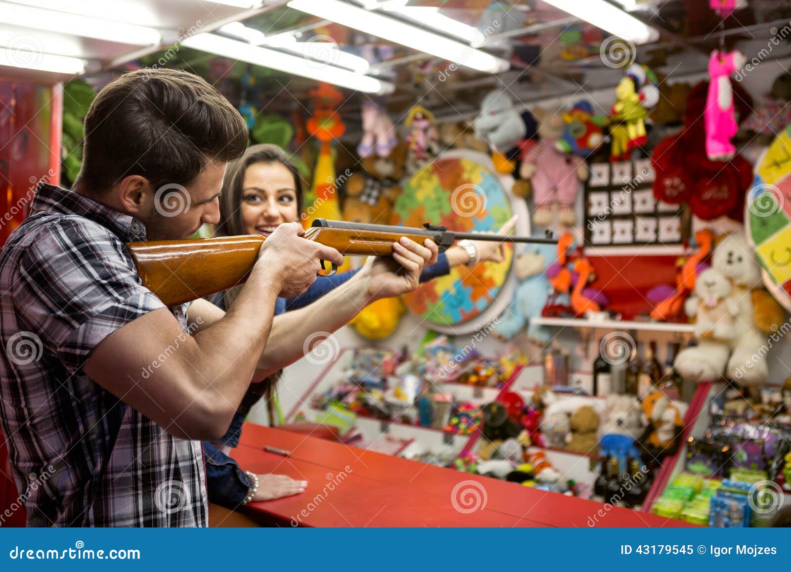 Young Fun Couple Playing Shooting Games Stock Image - Image of ...
