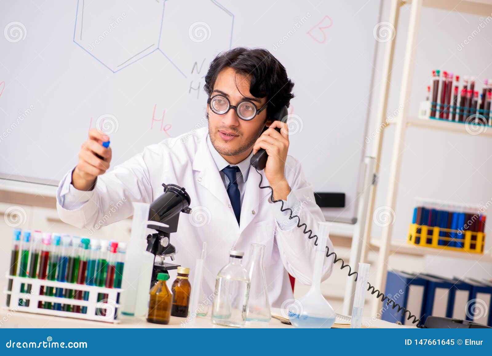 The Young Funny Chemist in Front of White Board Stock Image - Image of ...