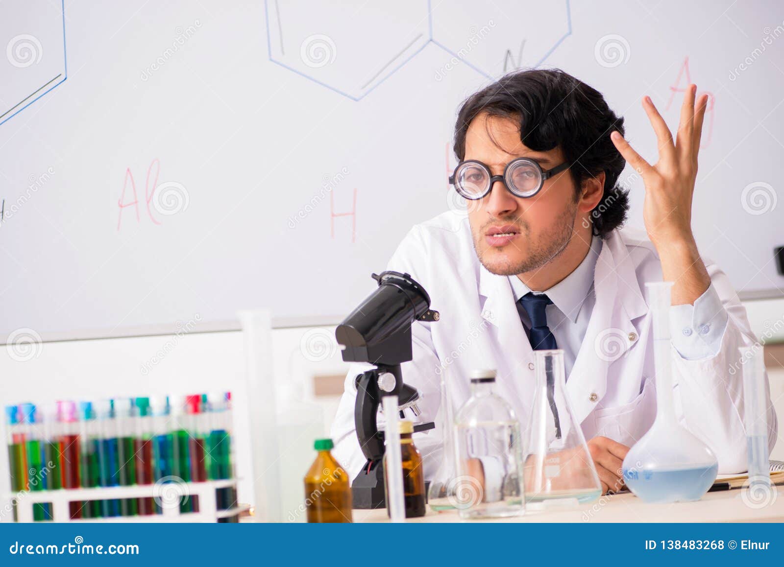 The Young Funny Chemist in Front of White Board Stock Photo - Image of ...