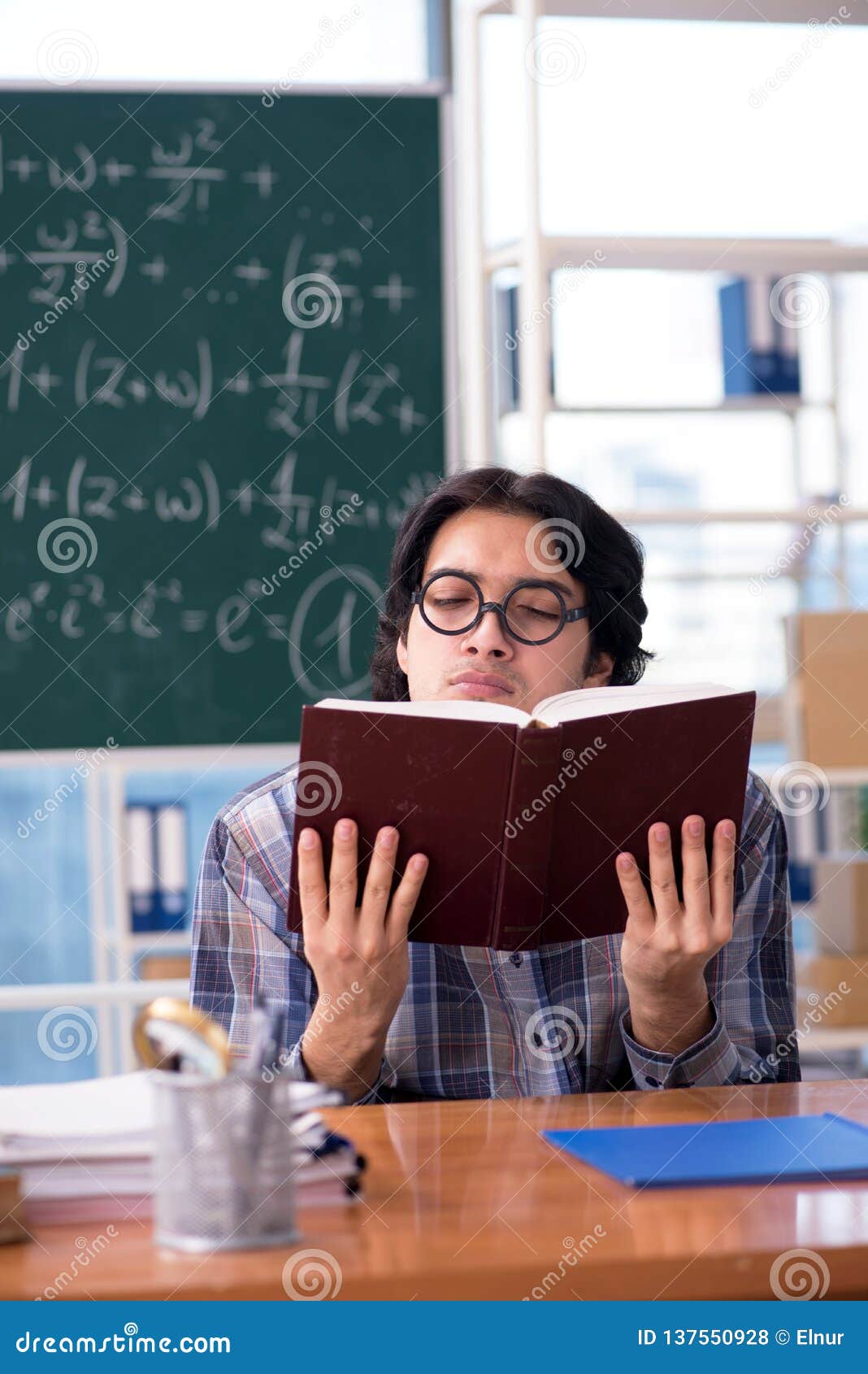 The Young Funny Math Teacher in Front of Chalkboard Stock Photo - Image ...