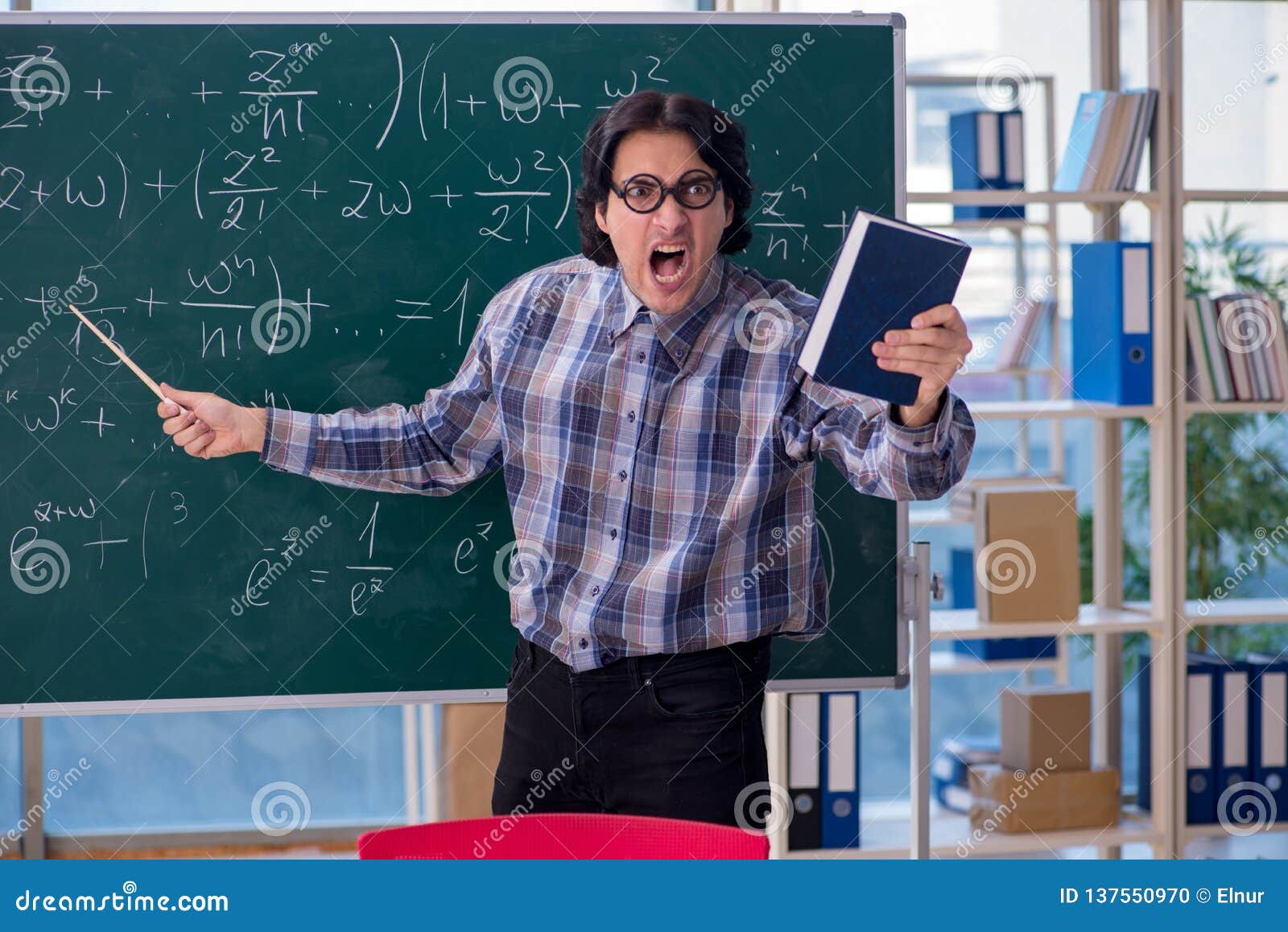 The Young Funny Math Teacher in Front of Chalkboard Stock Photo - Image ...