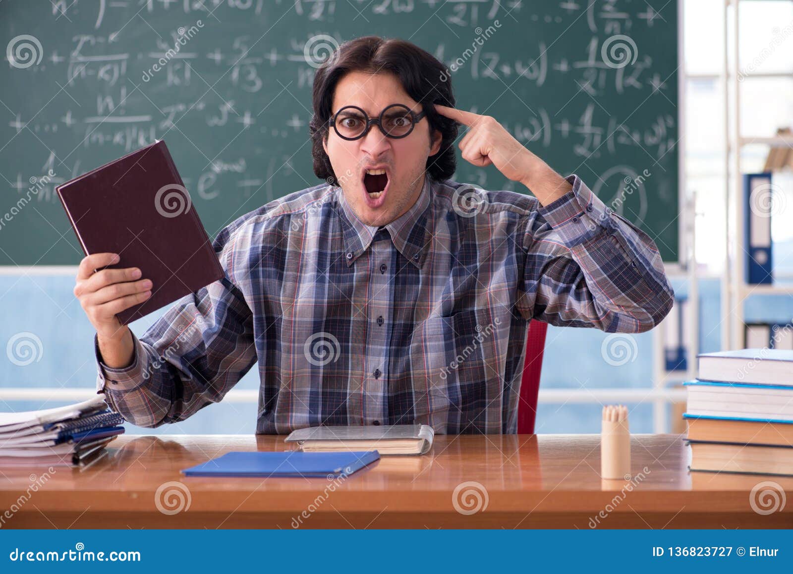 The Young Funny Math Teacher in Front of Chalkboard Stock Image - Image ...
