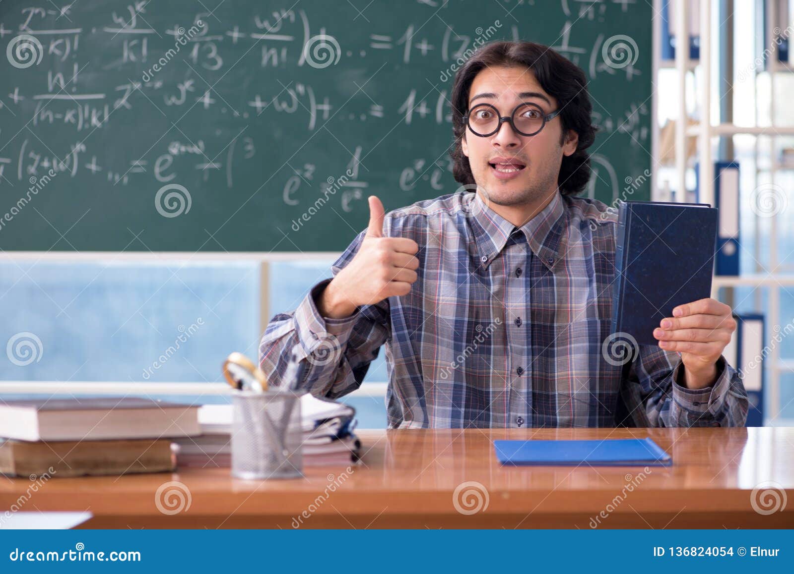 The Young Funny Math Teacher in Front of Chalkboard Stock Photo - Image ...