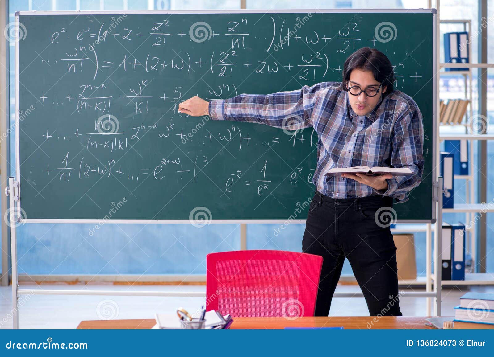 The Young Funny Math Teacher in Front of Chalkboard Stock Image - Image ...