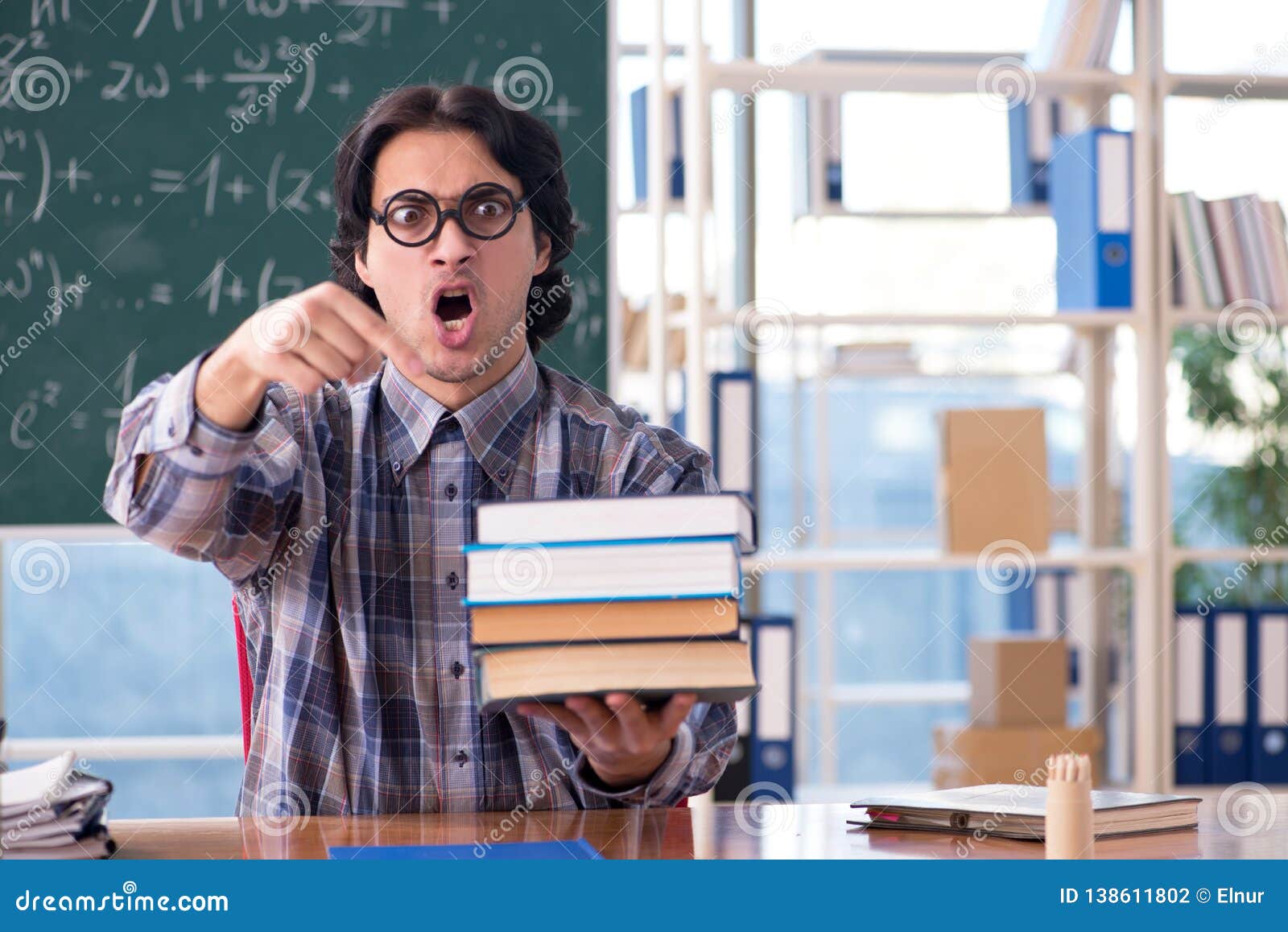 The Young Funny Math Teacher in Front of Chalkboard Stock Photo - Image ...