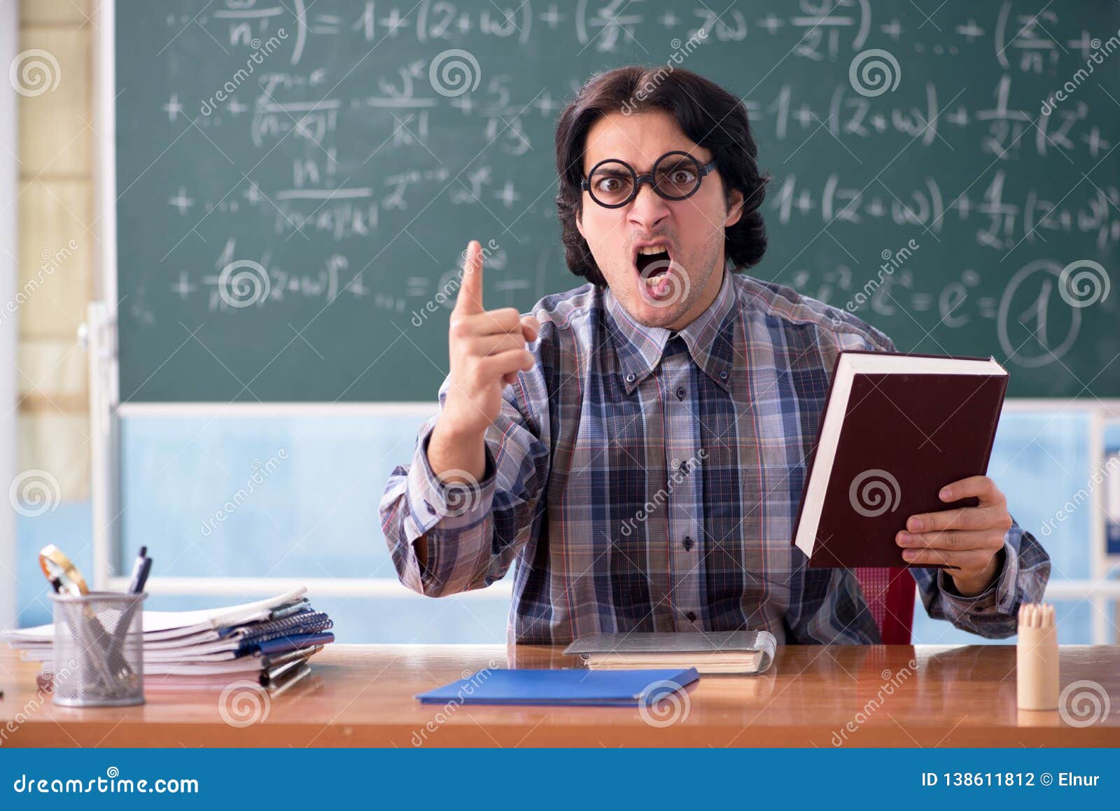 The Young Funny Math Teacher in Front of Chalkboard Stock Photo - Image ...