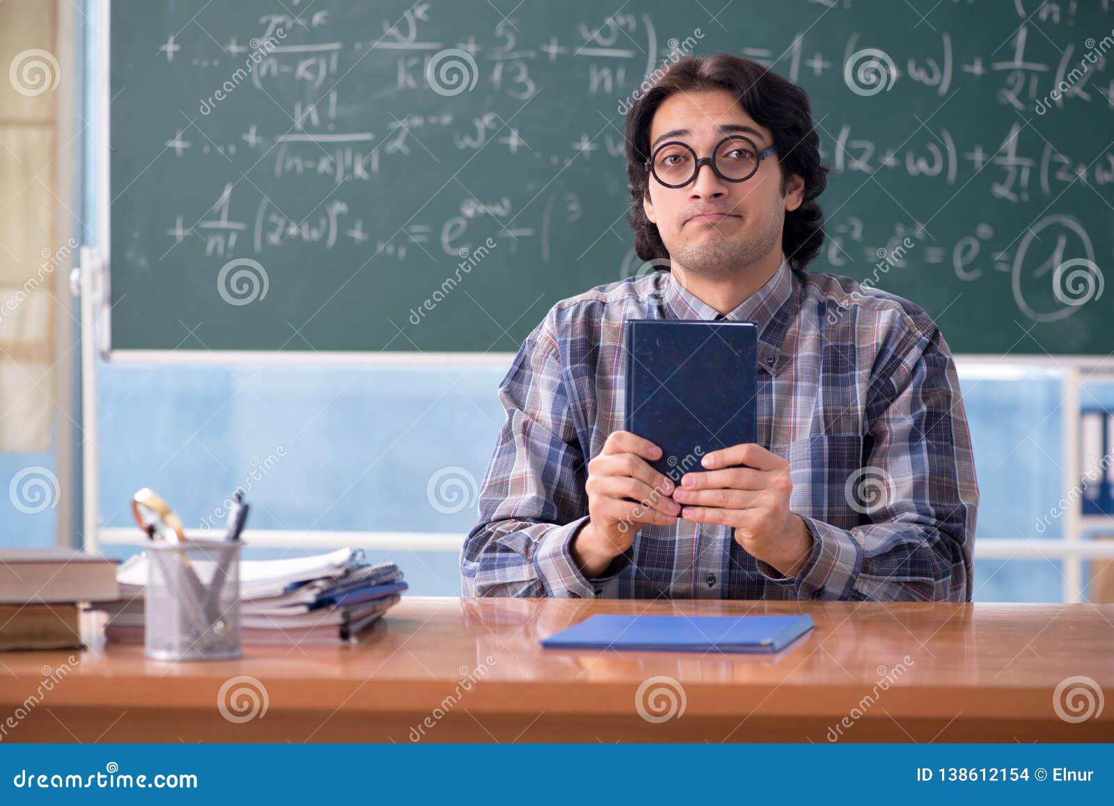 The Young Funny Math Teacher in Front of Chalkboard Stock Photo - Image ...