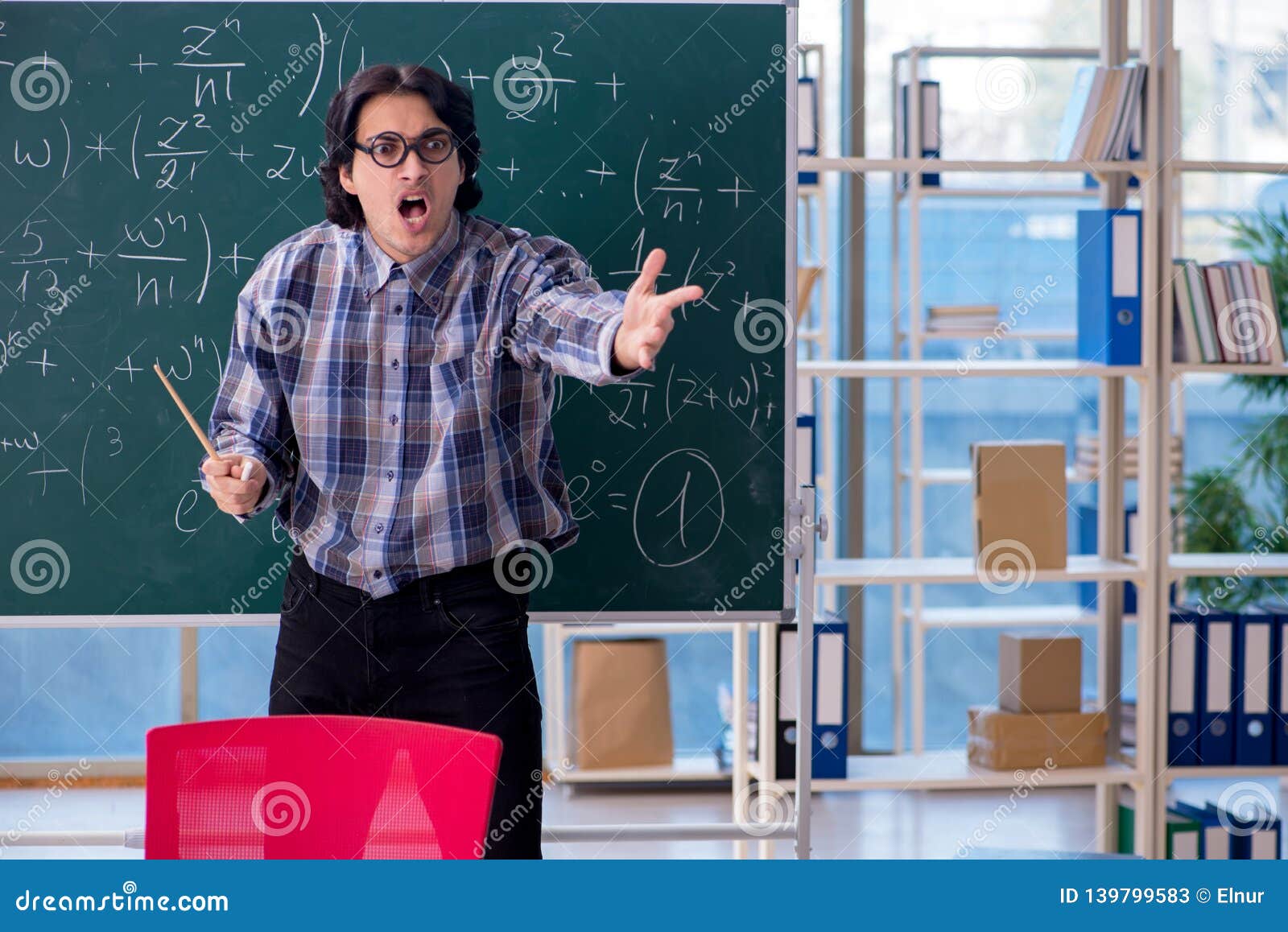 The Young Funny Math Teacher in Front of Chalkboard Stock Image - Image ...
