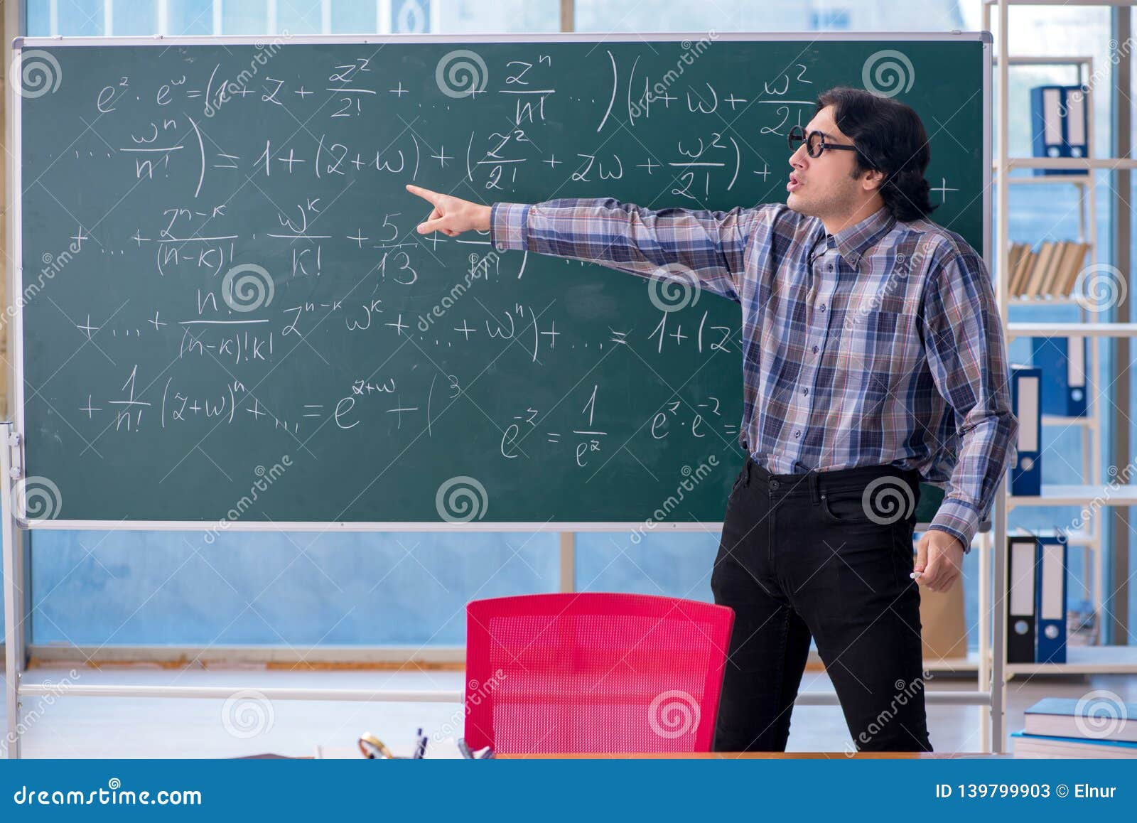 The Young Funny Math Teacher in Front of Chalkboard Stock Image - Image ...