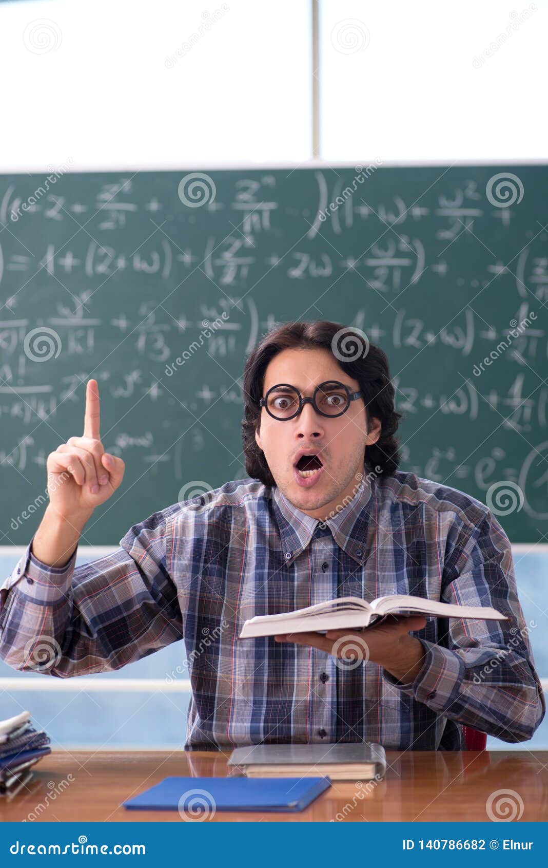 The Young Funny Math Teacher in Front of Chalkboard Stock Photo - Image ...