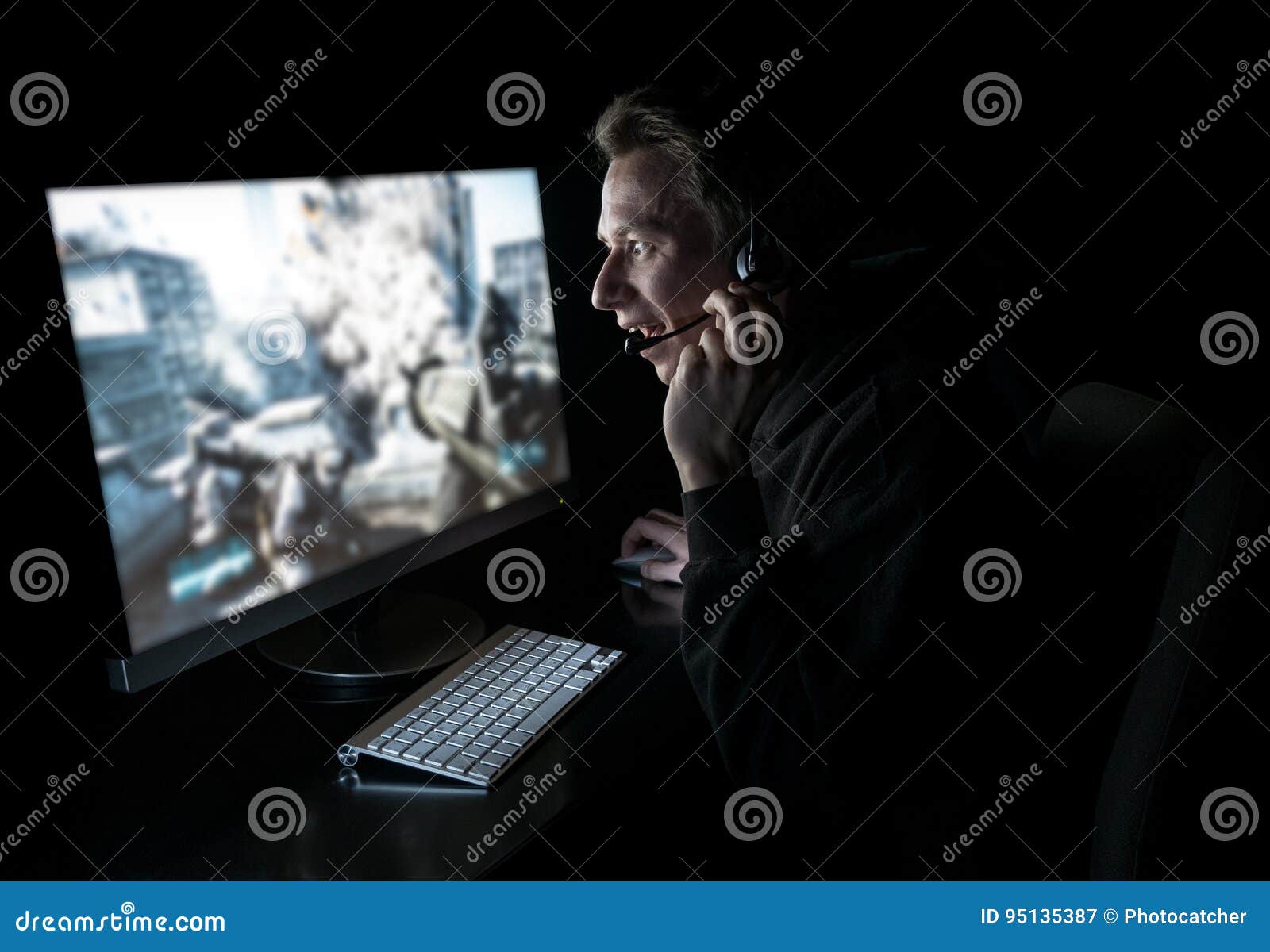 Young gamer in the dark stock image. Image of people - 95135387