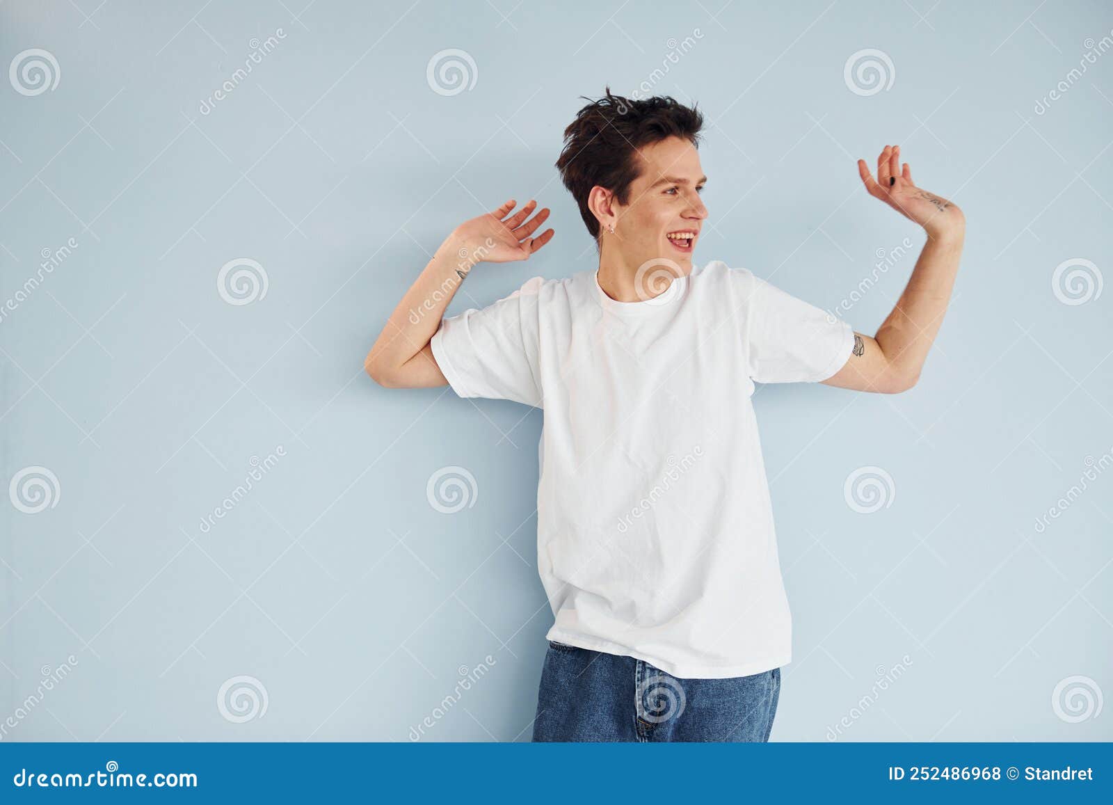 Young Gay Man is Standing in the Studio and Posing for a Camera Stock ...