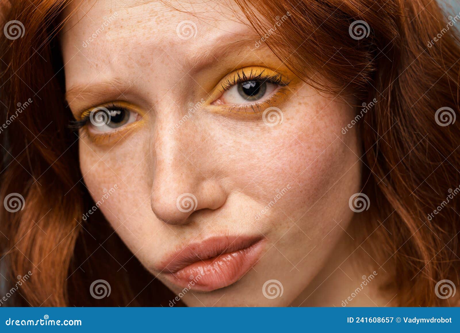 Young Ginger Confused Woman with Makeup Posing and Looking at Camera ...