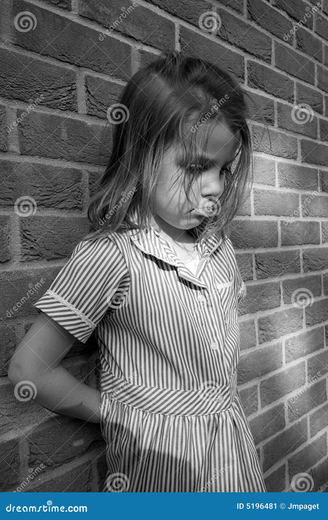 Young Girl Against a Brick Wall Stock Image - Image of depressed, curls ...