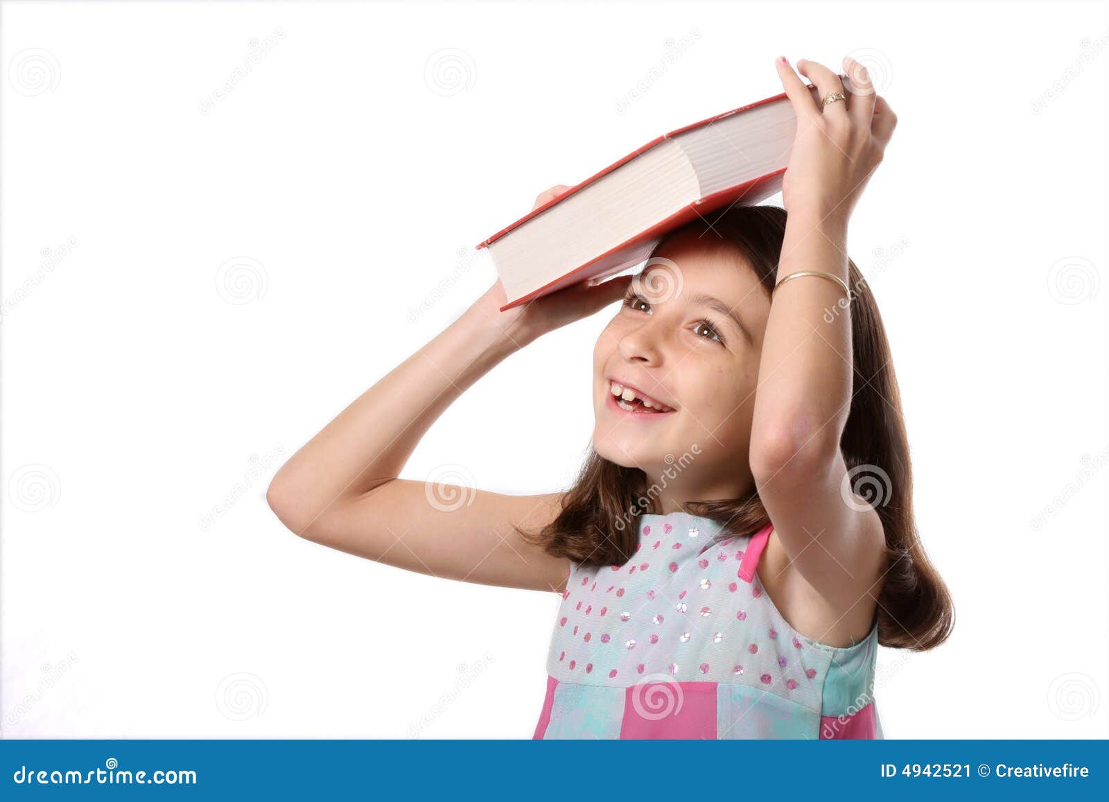 Young Girl Balancing Book on Head Stock Image - Image of finger, people ...