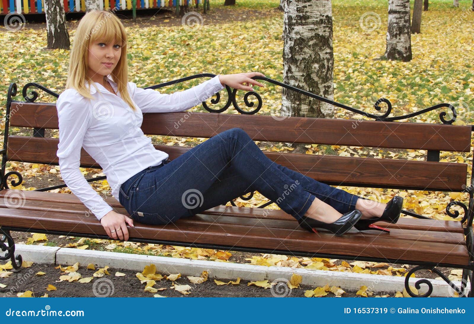 Young girl on a bench stock image. Image of autumn, bench - 16537319