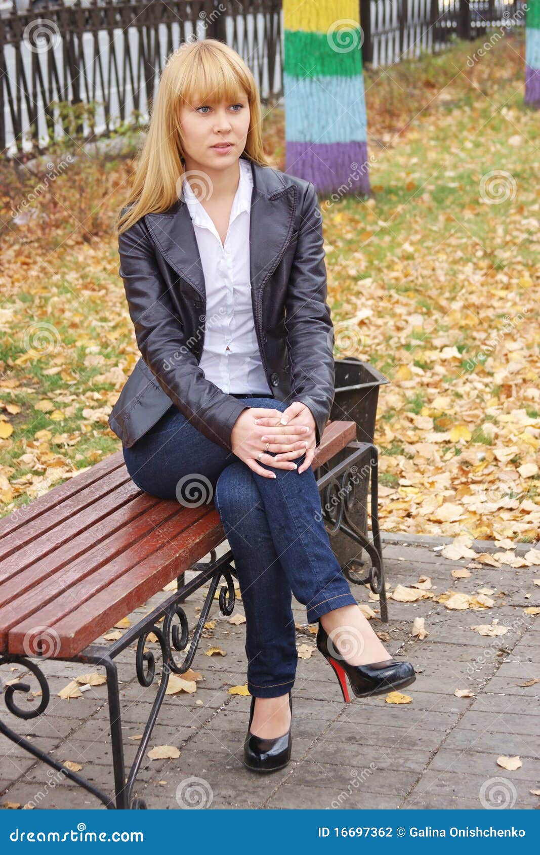 Young girl on a bench stock photo. Image of tree, yellow - 16697362