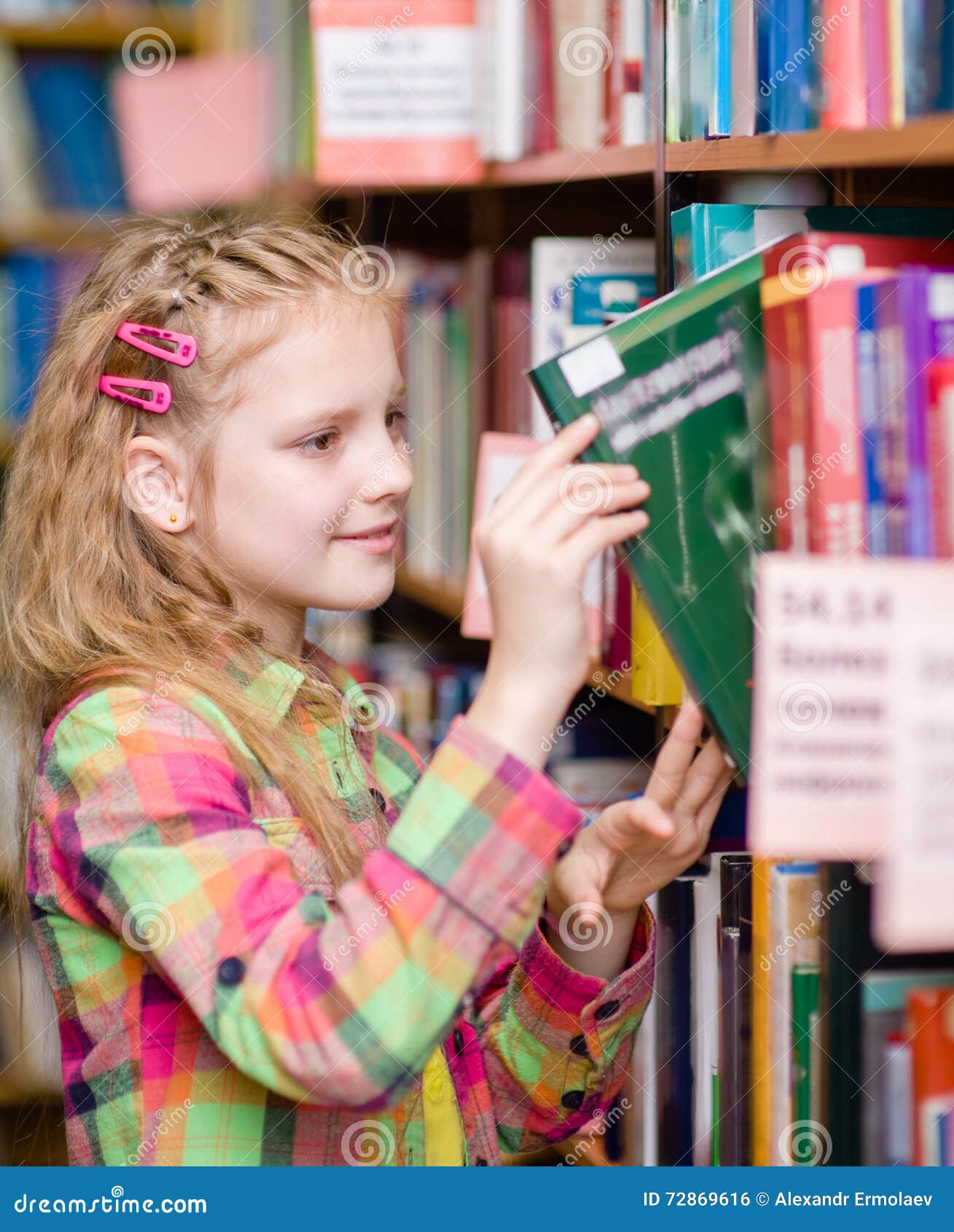 Young Girl Chooses a Book in the Library Stock Photo - Image of ...
