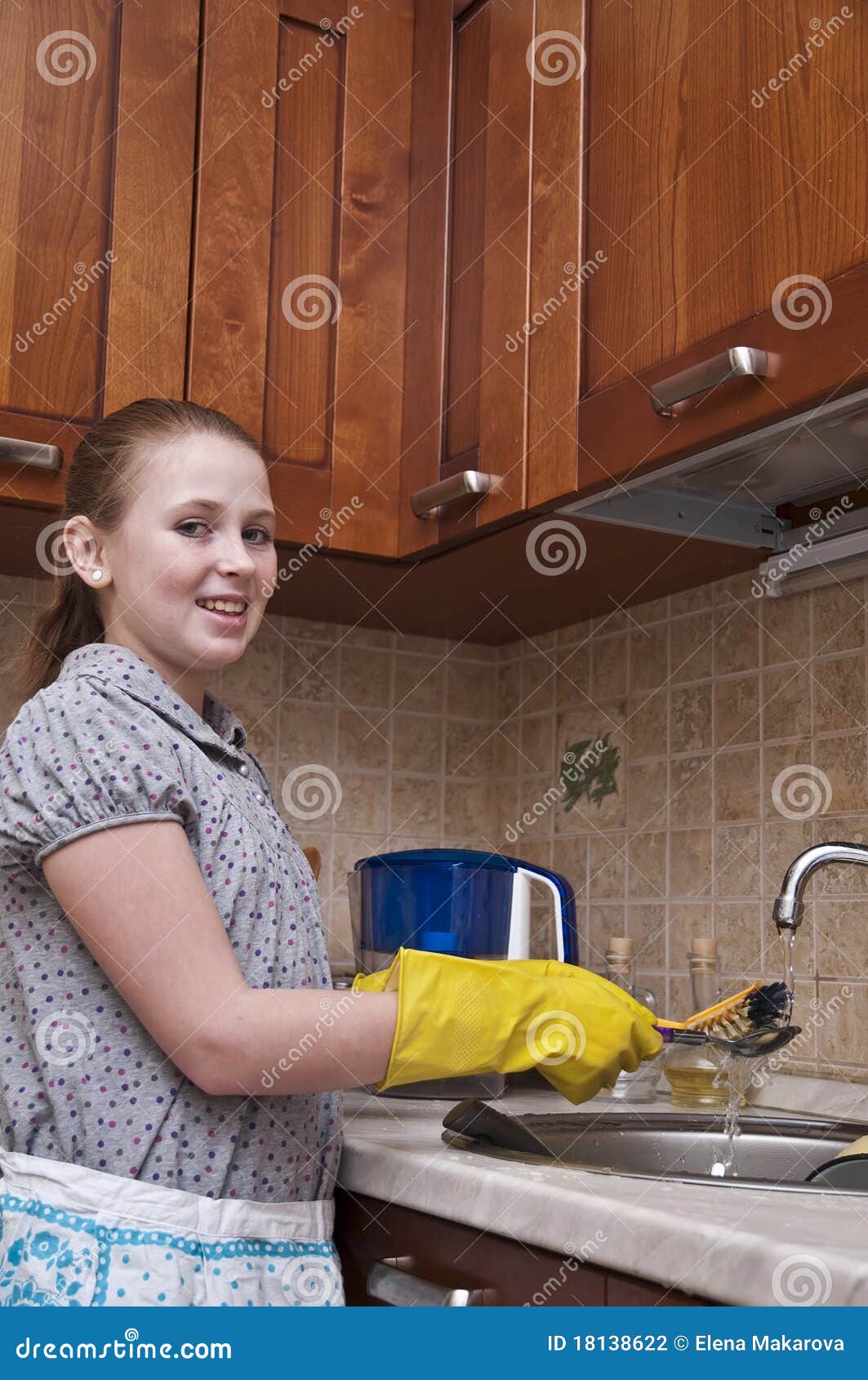 Young Girl Cleaning Dishes stock photo. Image of domestic - 18138622