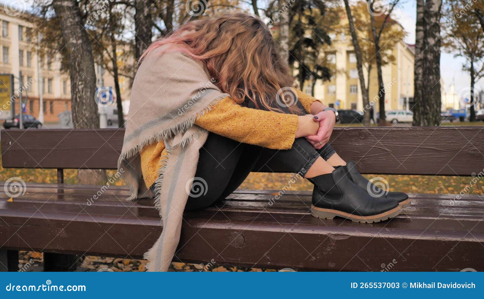 A Young Girl Crying on a Park Bench in the Fall. Stock Video - Video of ...