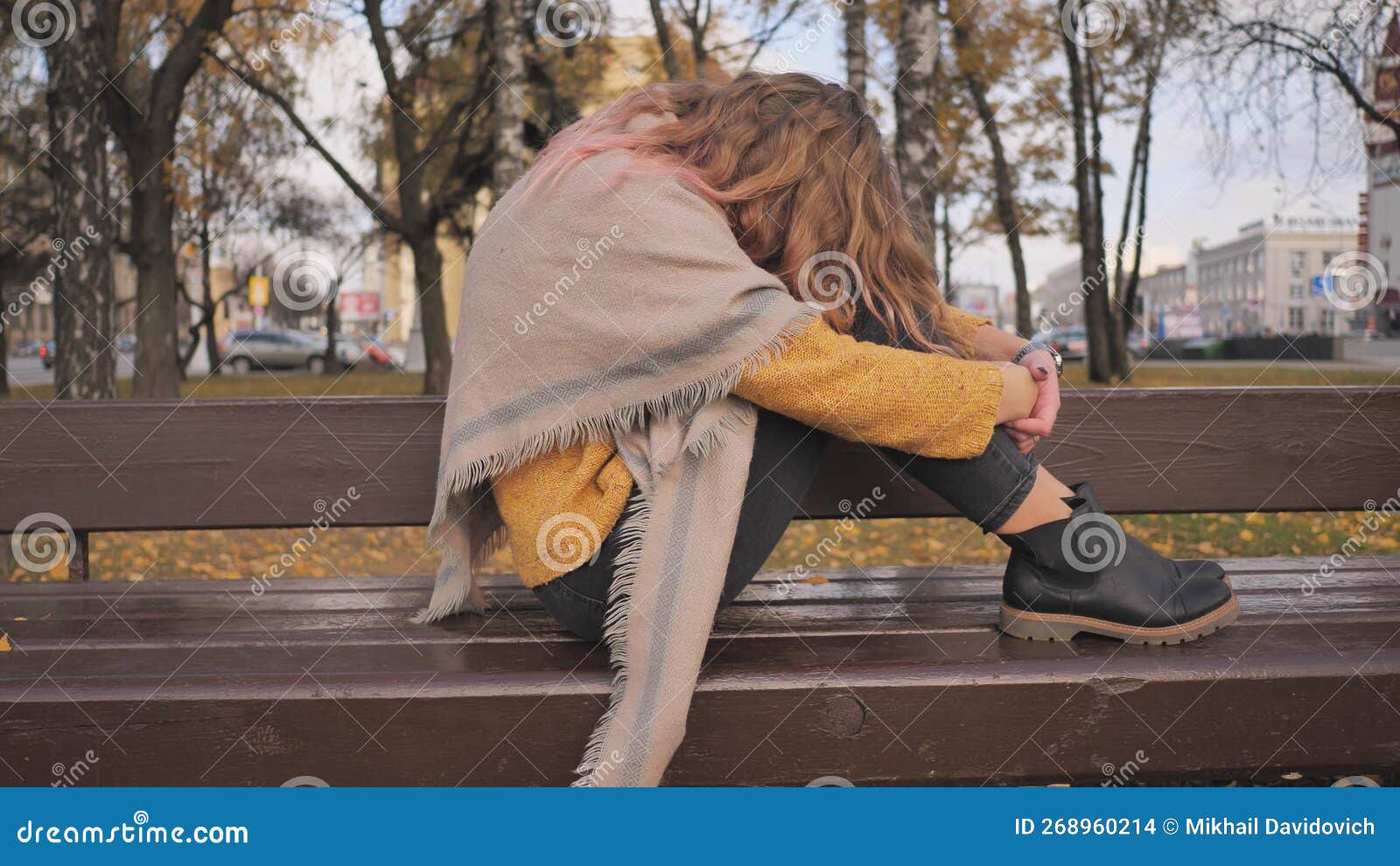 A Young Girl Crying on a Park Bench in the Fall. Stock Photo - Image of ...