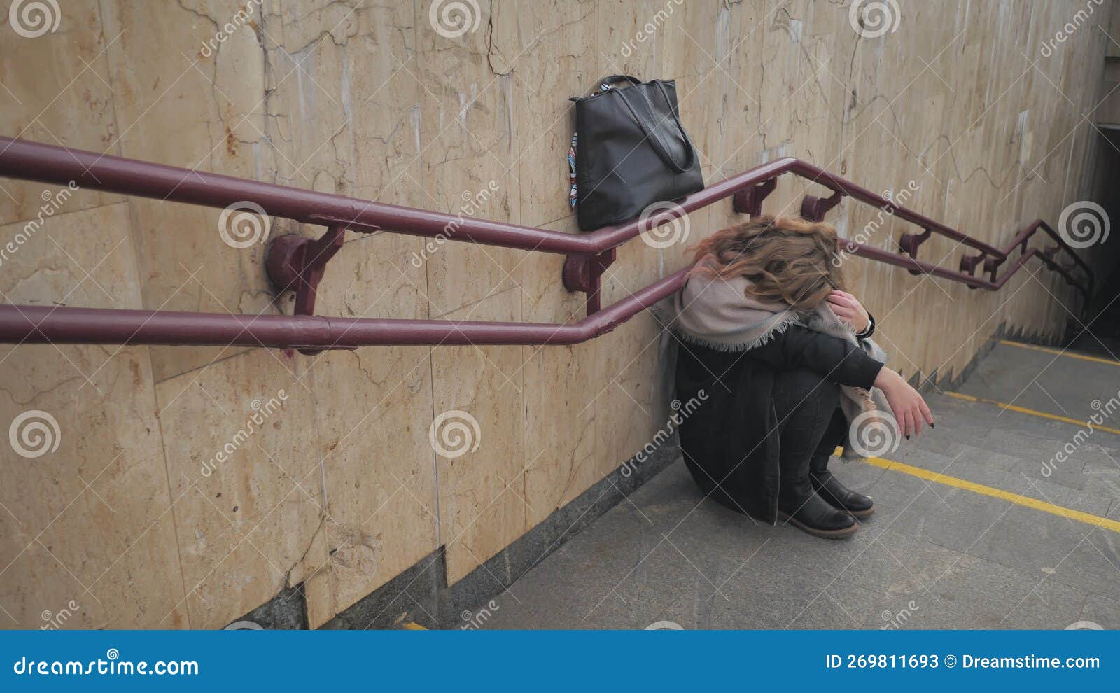 A Young Girl Crying by the Stairs in the Subway. Stock Image - Image of ...