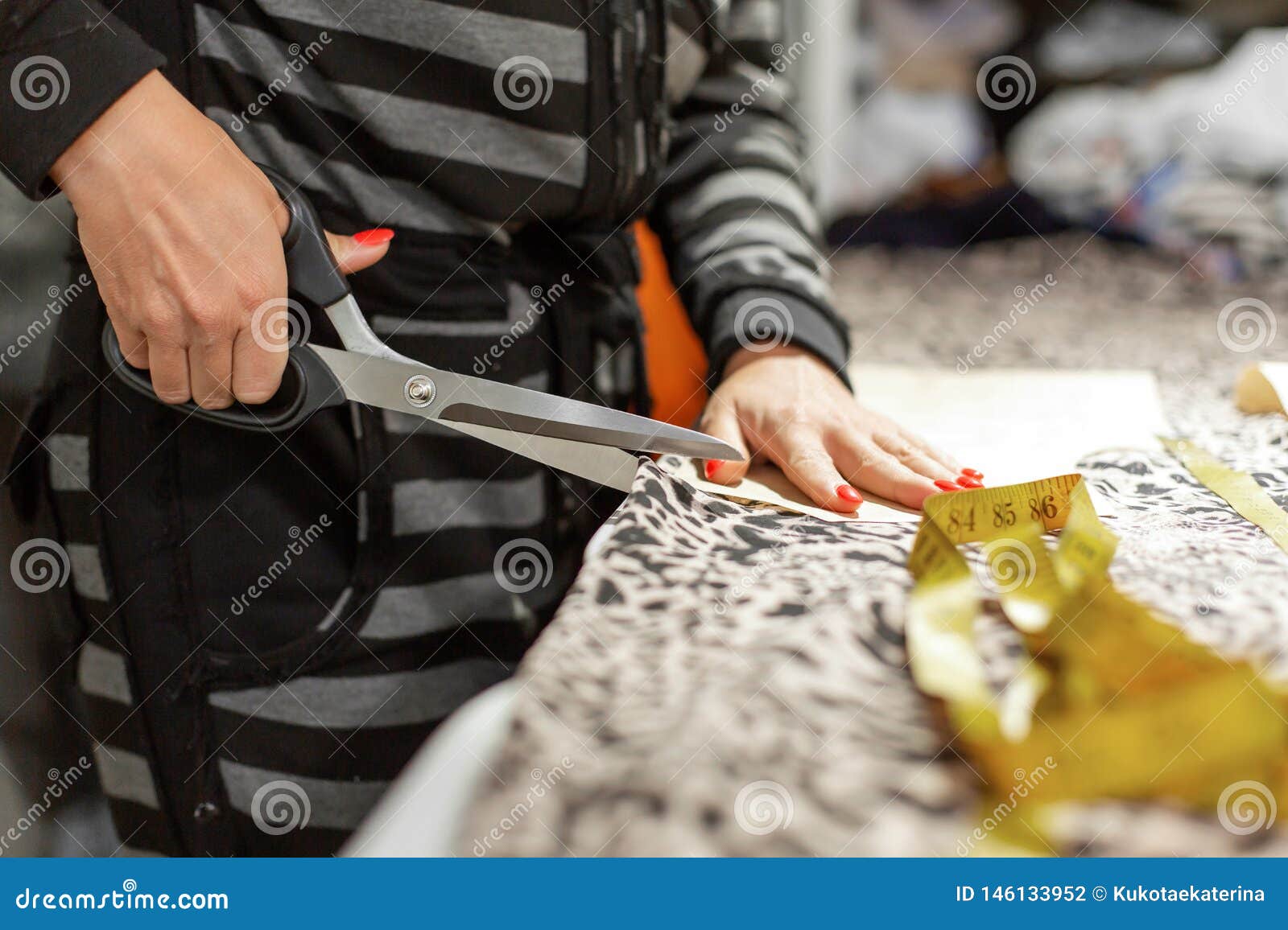 A Young Girl Designer of Clothes, Cut Fabric by Pattern To Create ...