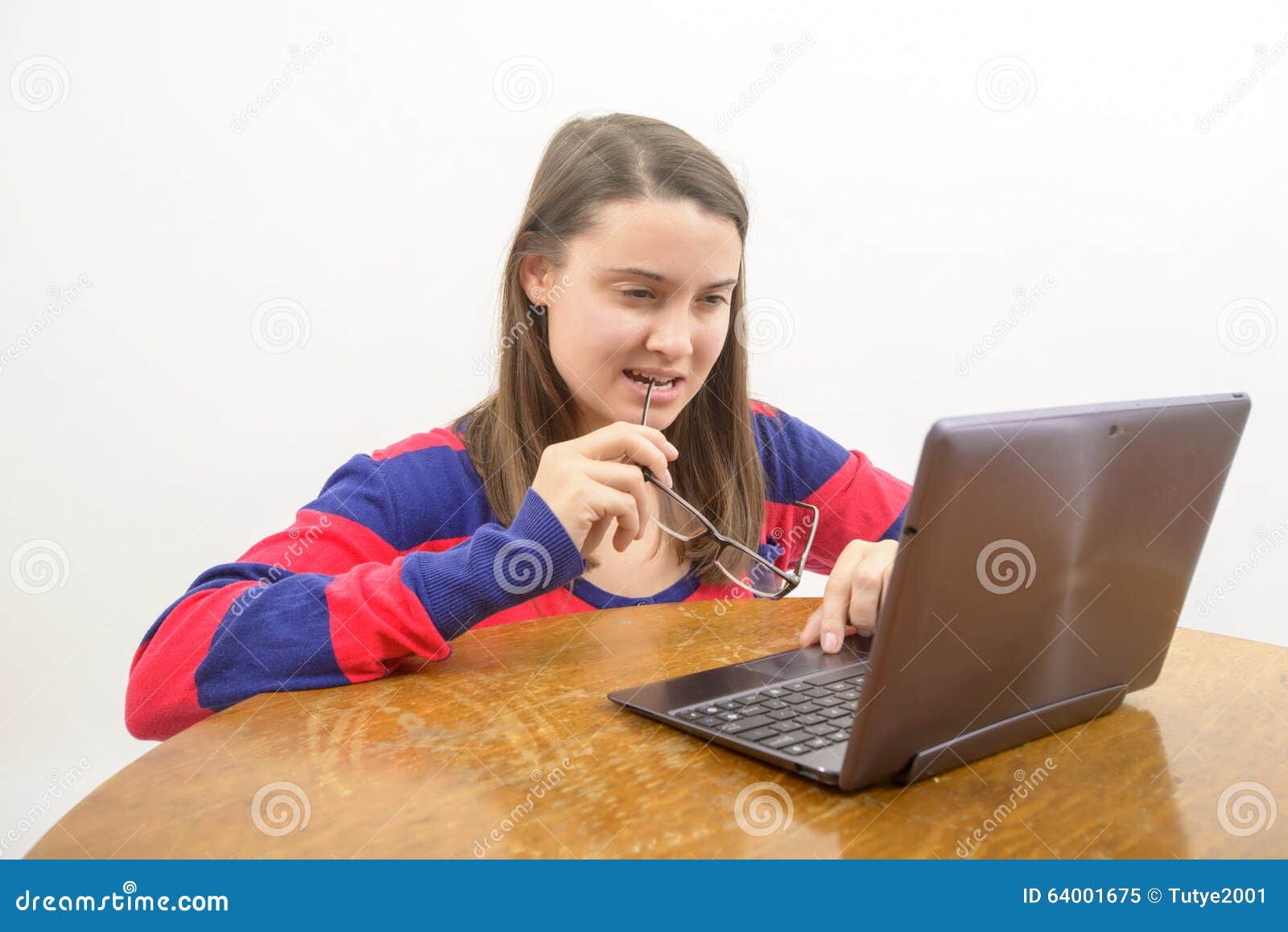 Young Girl at Desktop Looking at Laptop Isolated Stock Image - Image of ...