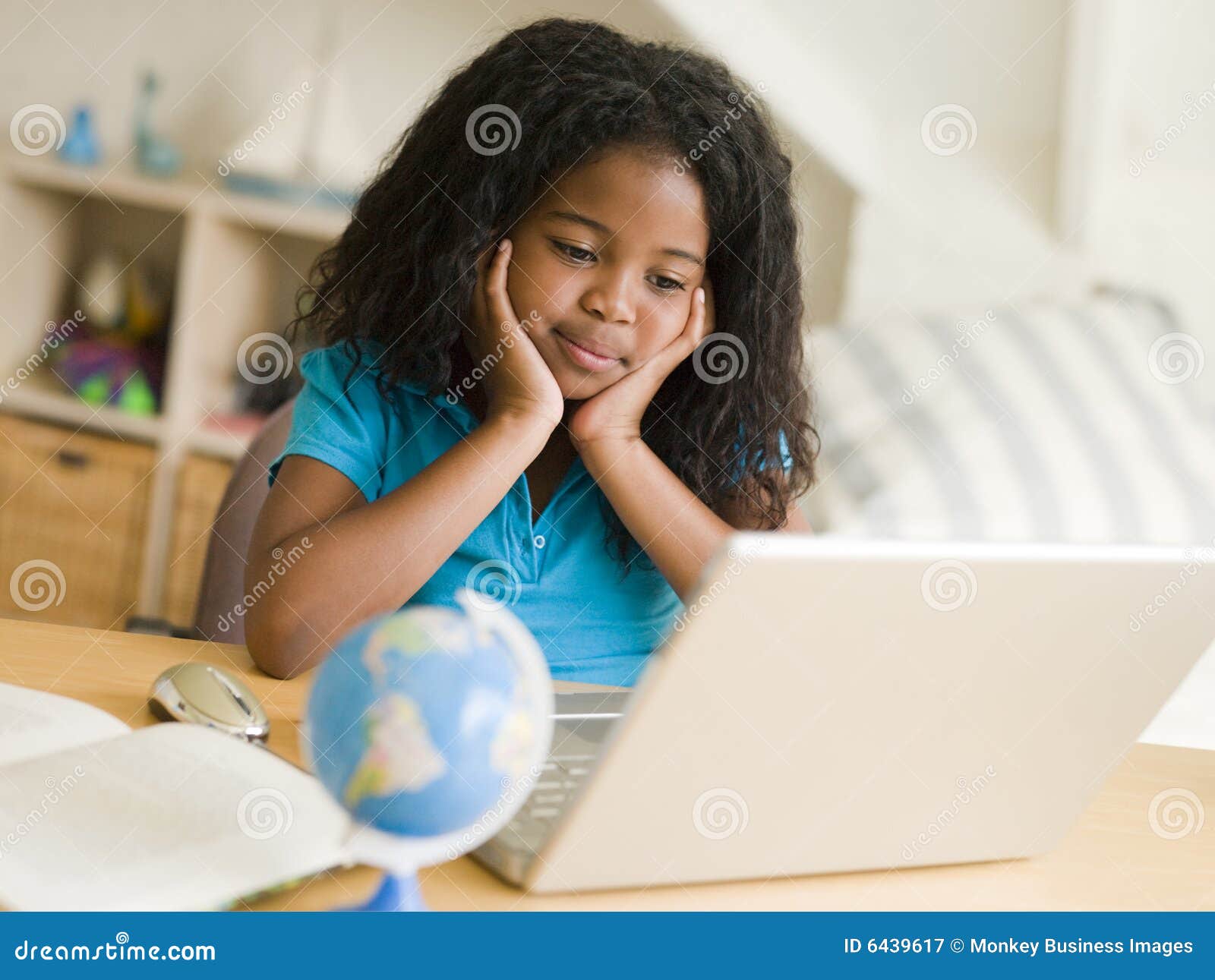 Young Girl Doing Her Homework on a Laptop Stock Image - Image of ...