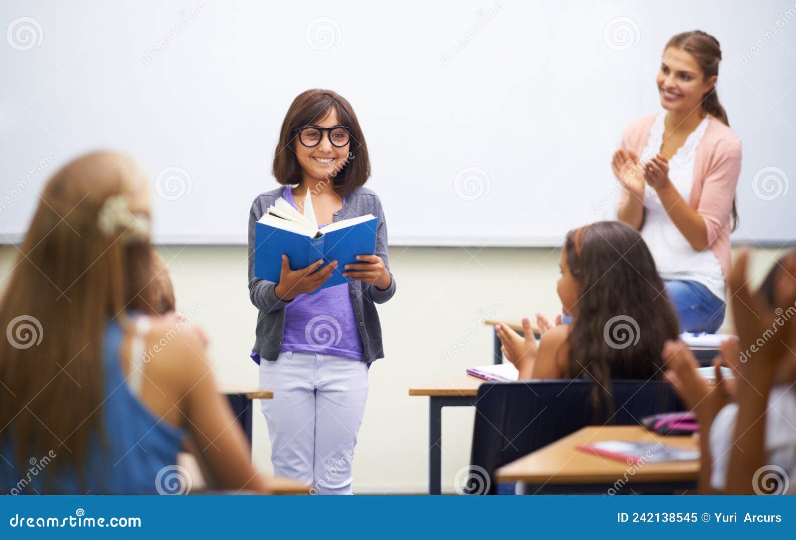 Prepared Reading. a Young Girl Doing Prepared Reading at the Front of ...