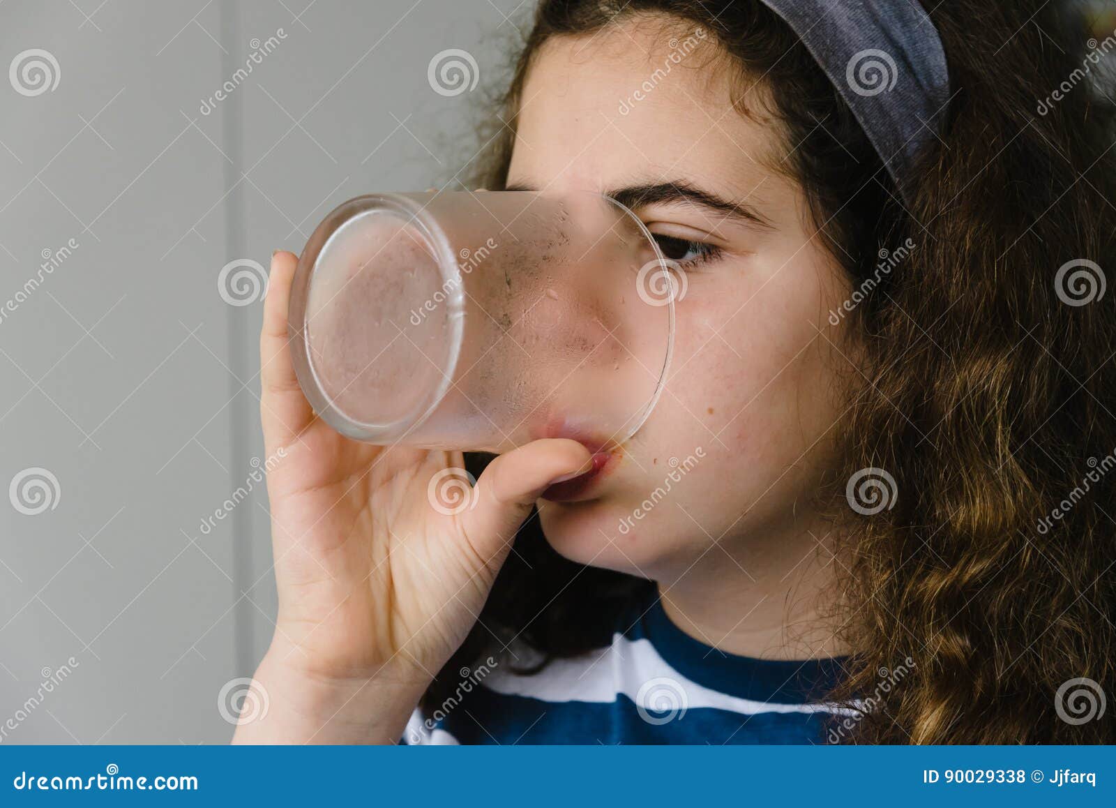 Young Girl Drinking Water and Eating at Home Stock Photo - Image of ...