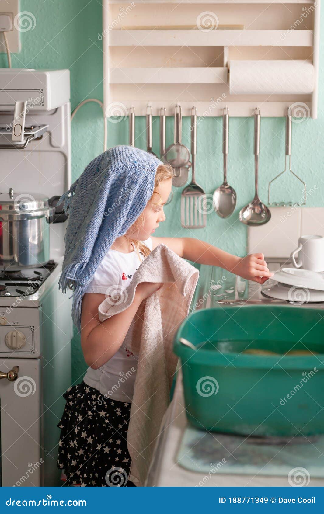 A Young Girl Drying Dishes at a Kitchen Sink Stock Image - Image of ...