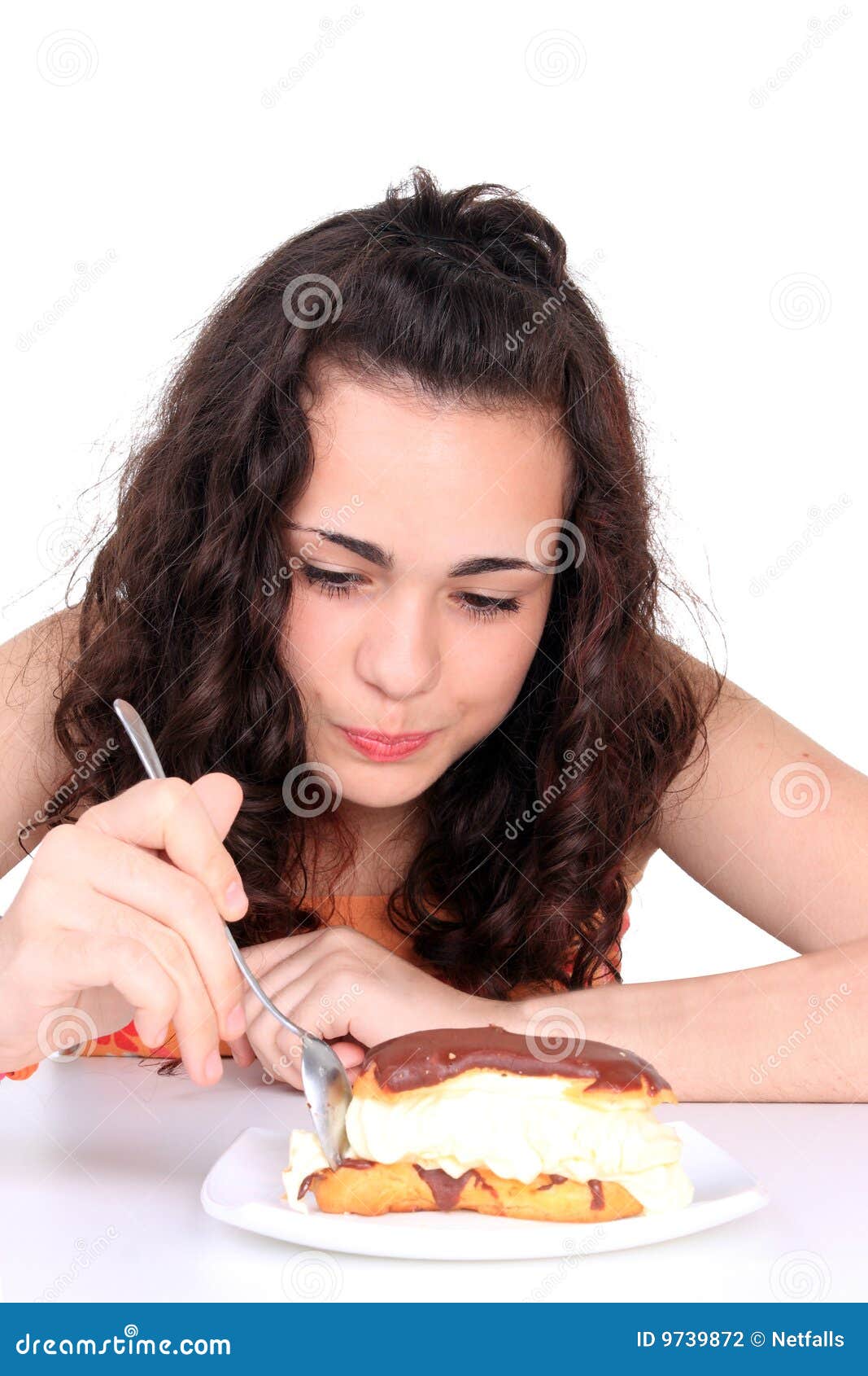 Young girl eating cake stock photo. Image of hand, copy - 9739872