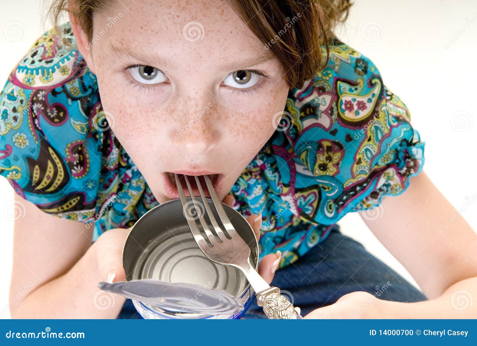 Young girl eating from can stock photo. Image of meal - 14000700