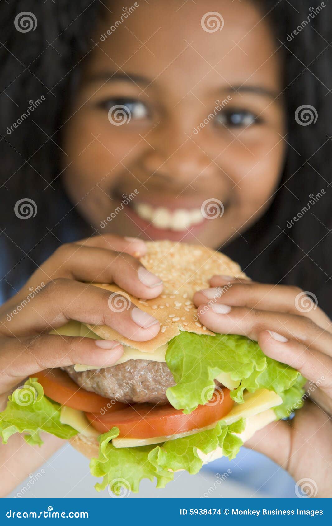 Young Girl Eating Cheeseburger Smiling Stock Photo - Image of head ...