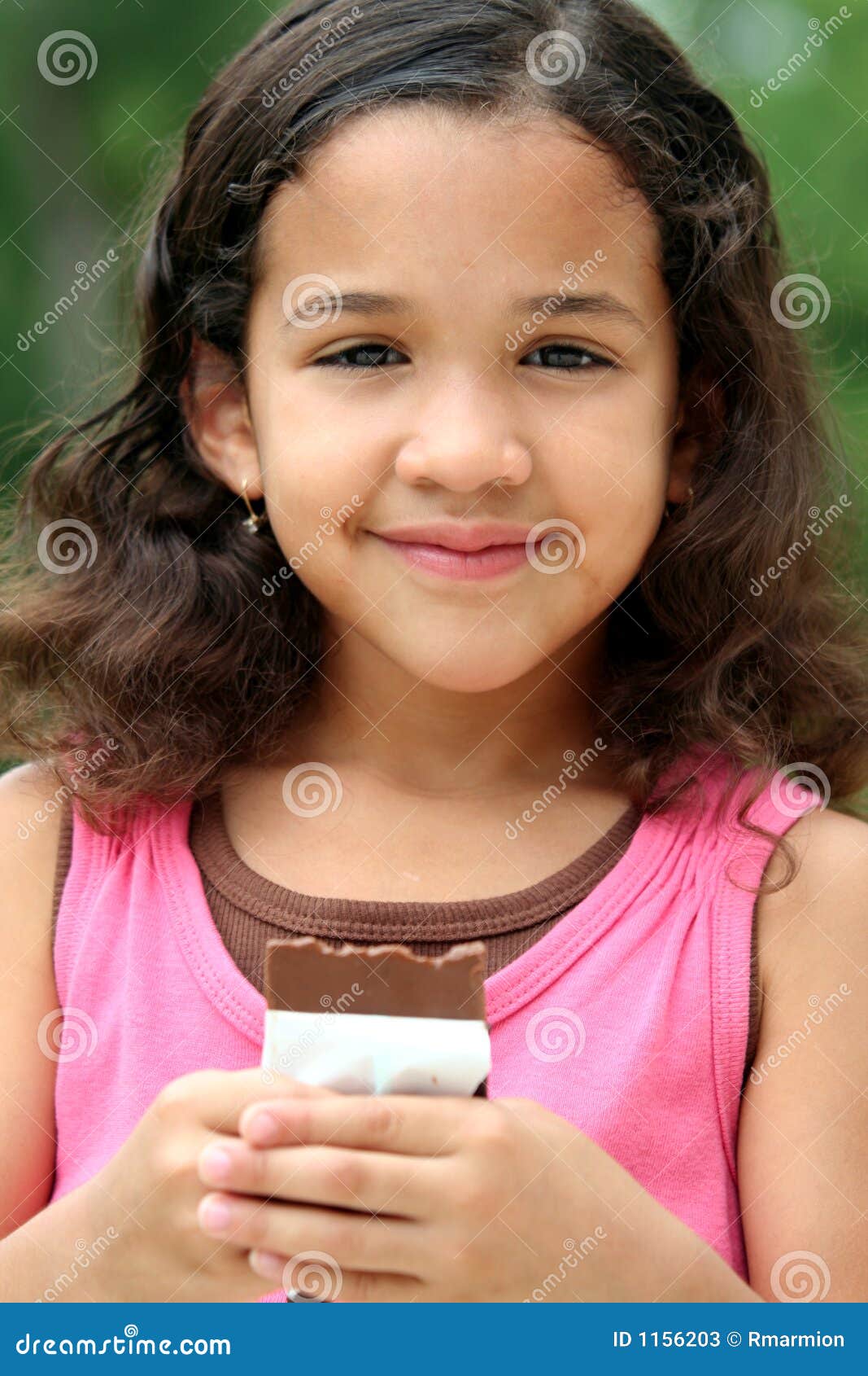 Young Girl Eating Chocolate Stock Image - Image of girls, happy: 1156203