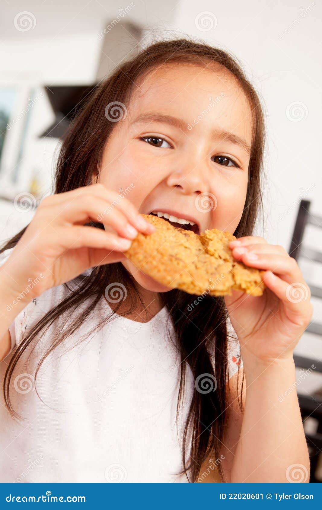 Young Girl Eating Cookie stock image. Image of enjoymant - 22020601