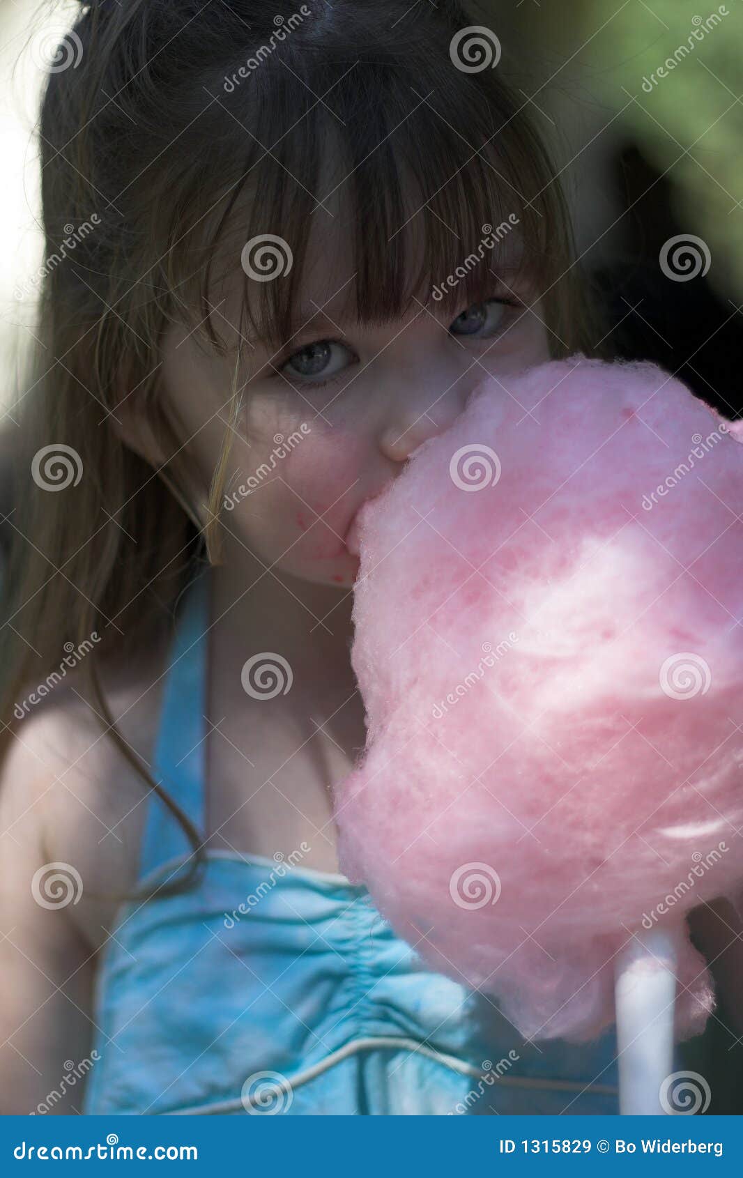 Young Girl Eating Cotton Candy Stock Image - Image of candy, flavor ...