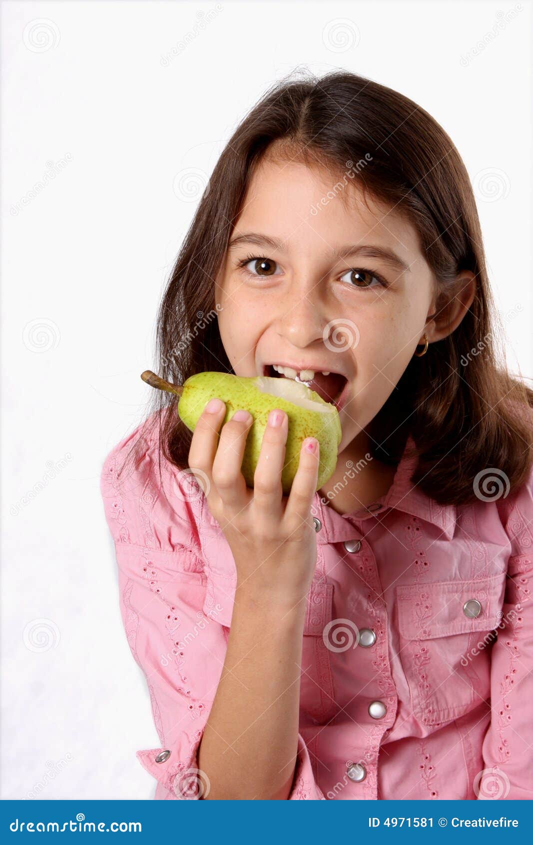 Young Girl Eating Fresh Green Pear Stock Image - Image: 4971581