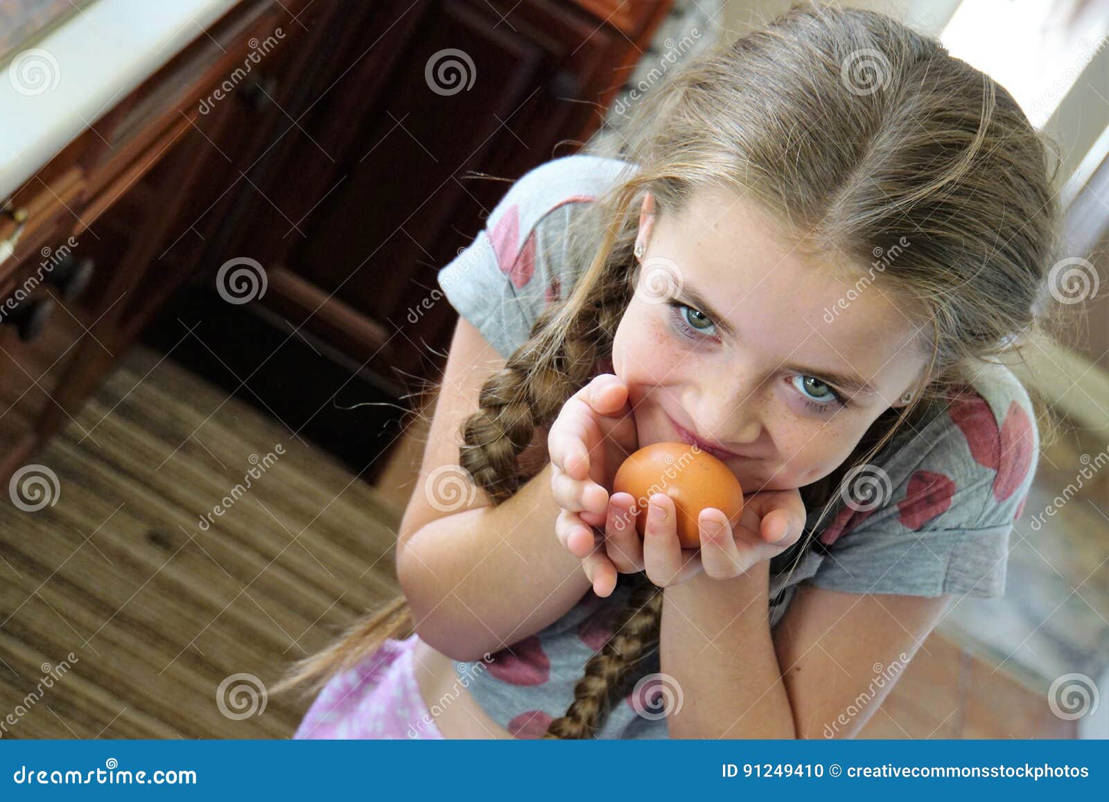 Young Girl With Egg Picture. Image: 91249410