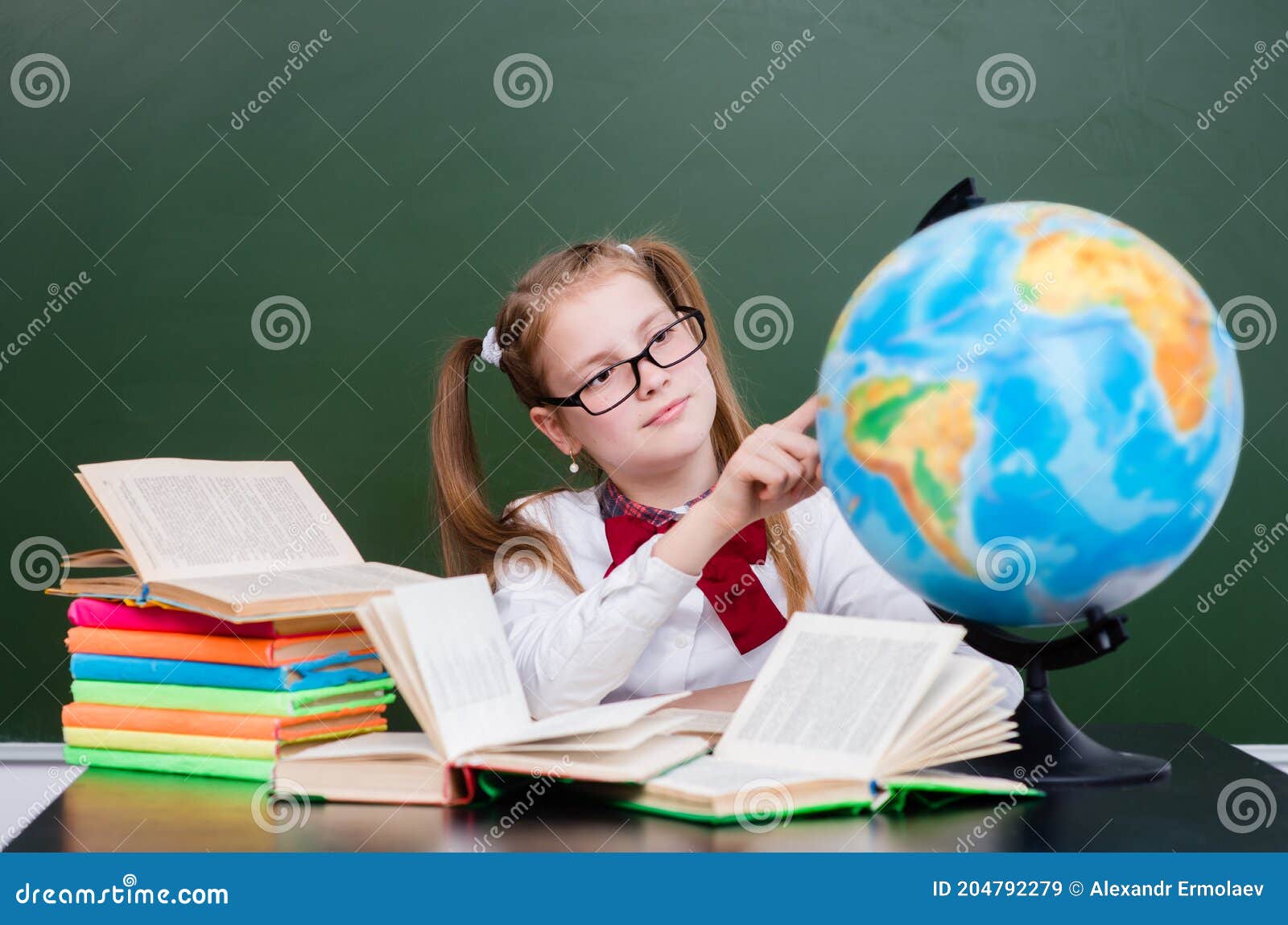 Young Girl Exploring the Globe in Classroom Stock Image - Image of ...