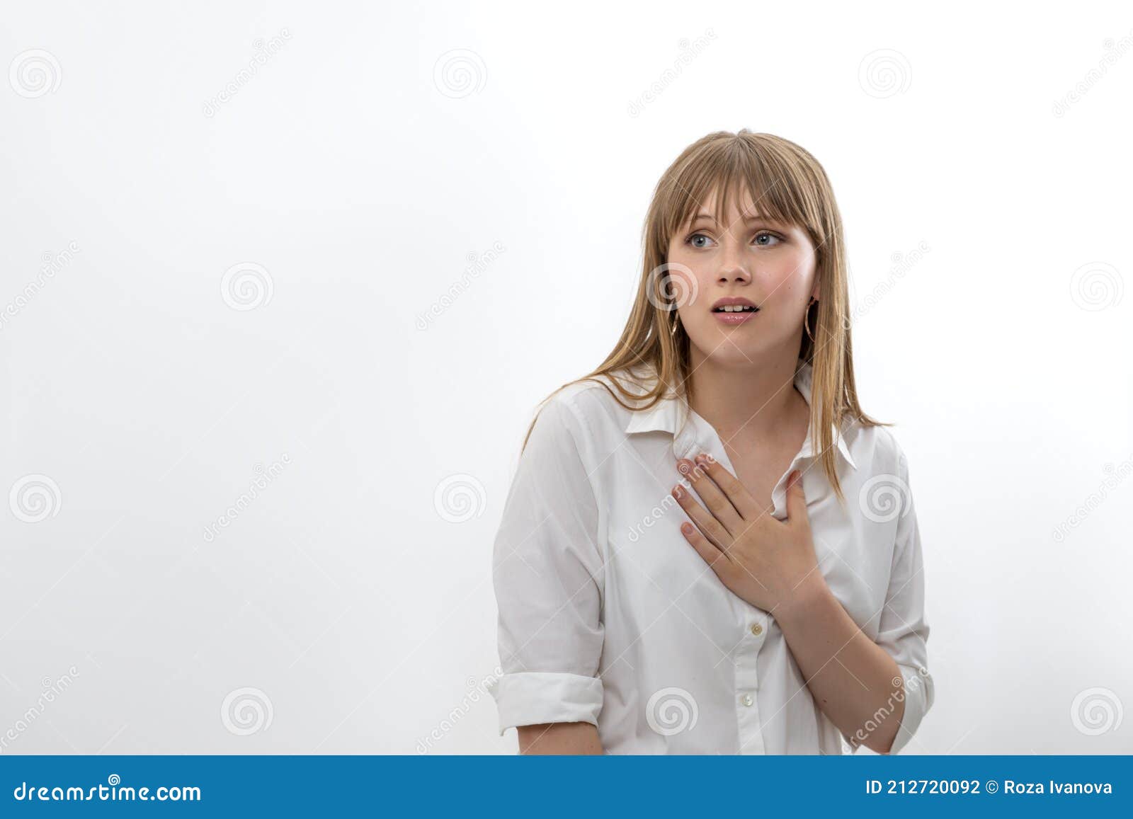 Young Girl With Frightened Or Surprised Expression And Holding Hand On