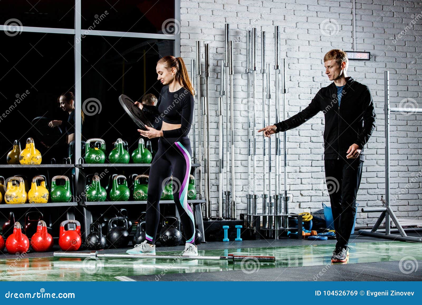The Girl is Getting Ready for the Exercise with the Trainer Stock Image ...