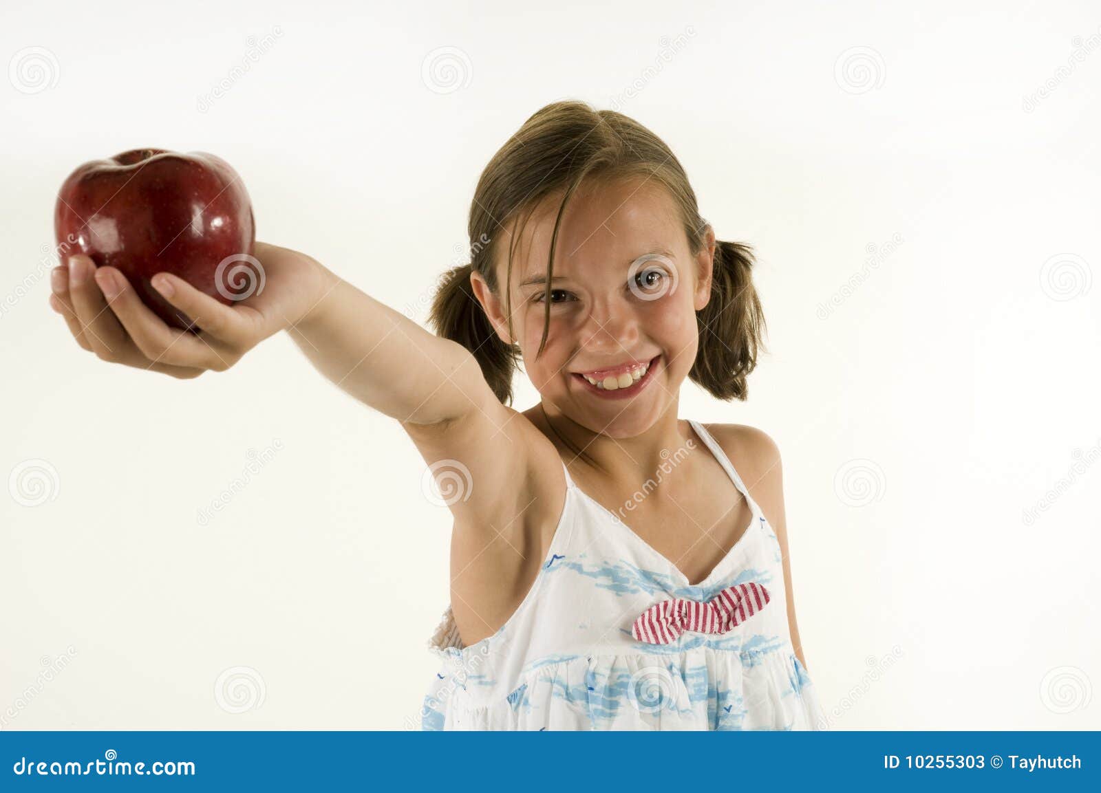 Young girl giving an apple stock image. Image of white - 10255303