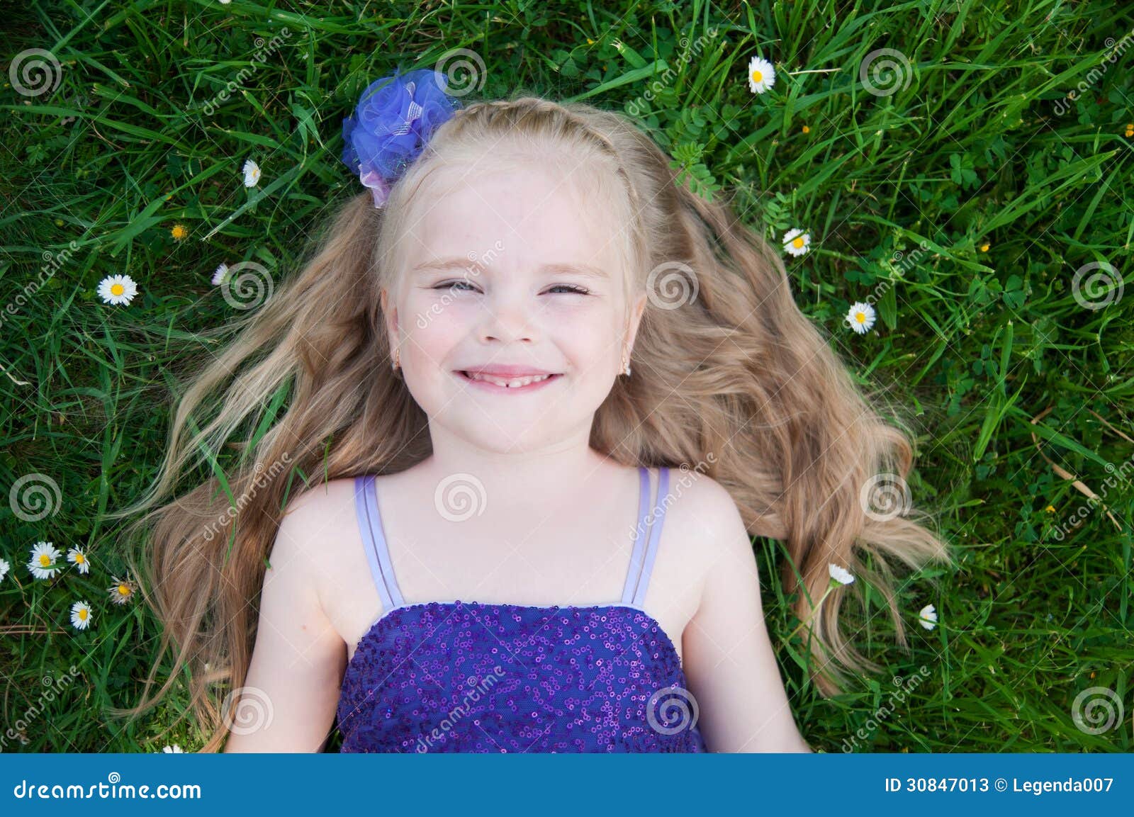 A Young Girl on a Green Grass Stock Image - Image of face, hairs: 30847013