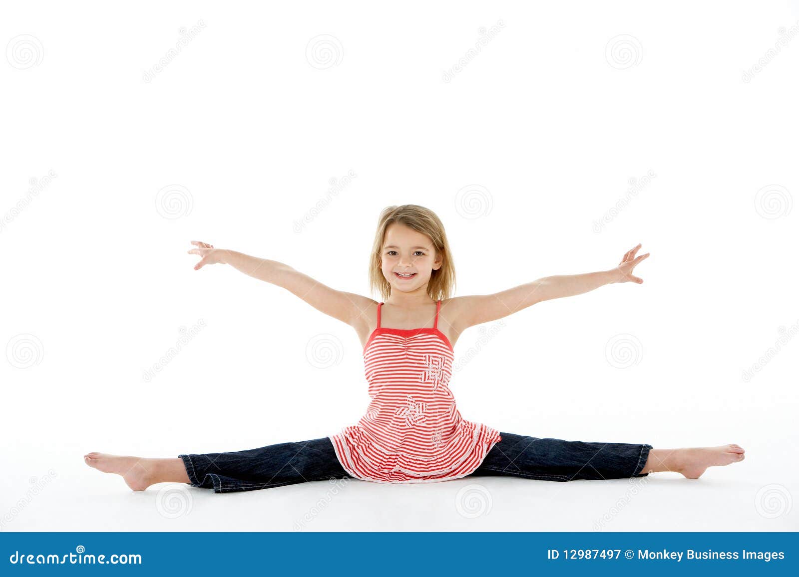 Girl Splits On Blue Background Stock Photo | CartoonDealer.com #77187282